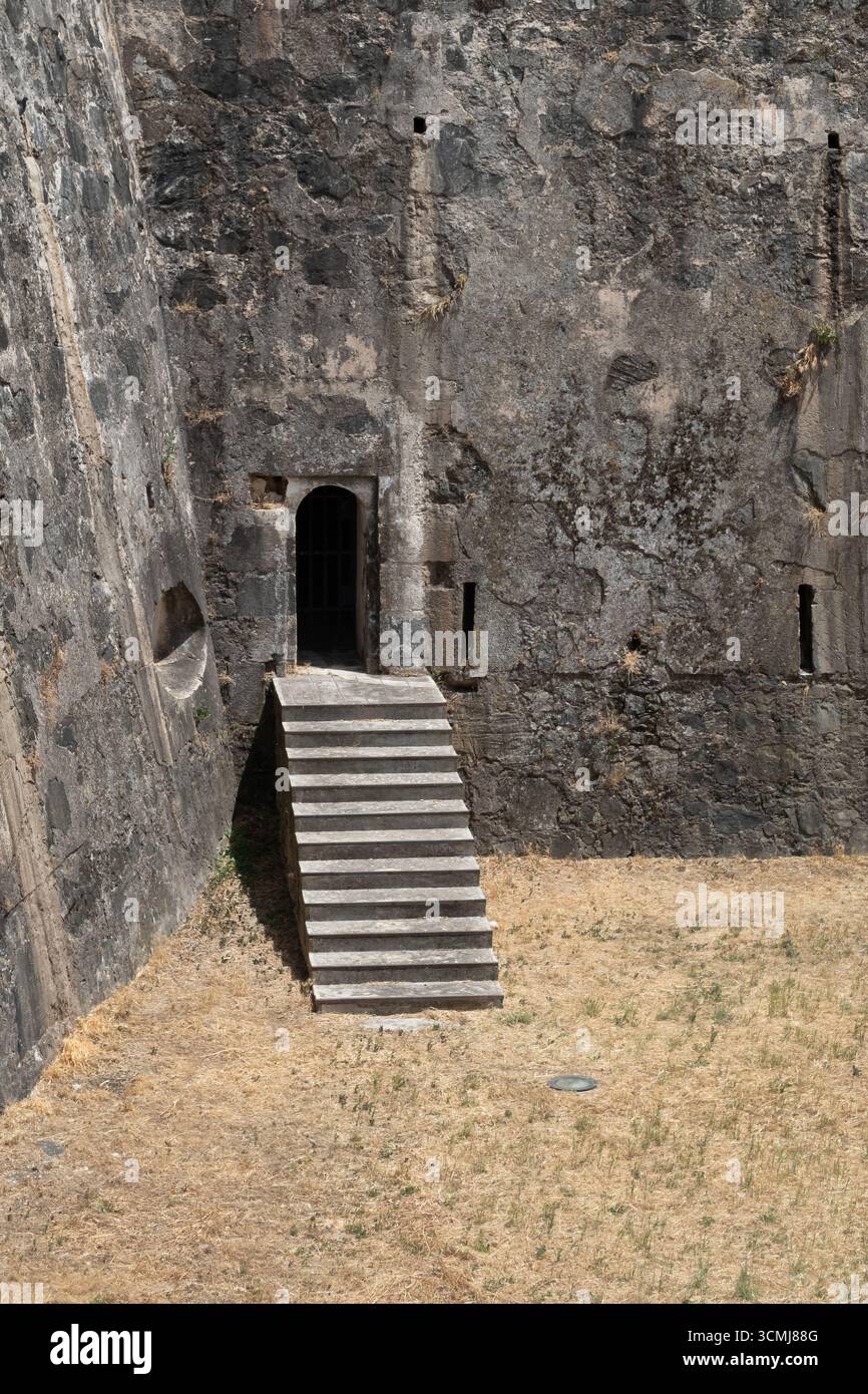 Architectural exterior detail of rock walls, stairs and portals of 18th ...