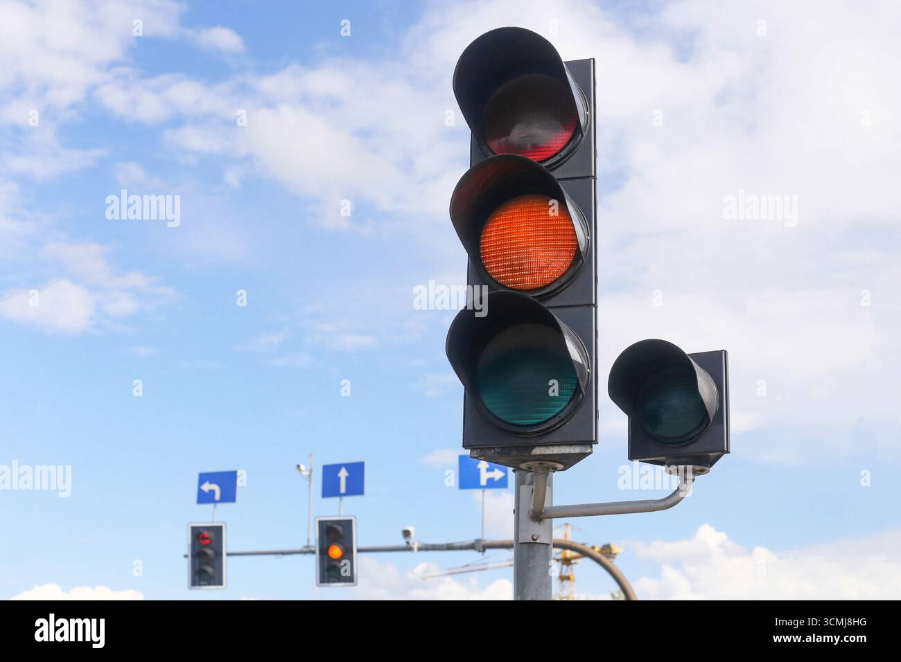 Traffic light with orange signal on. Road safety and transportation ...