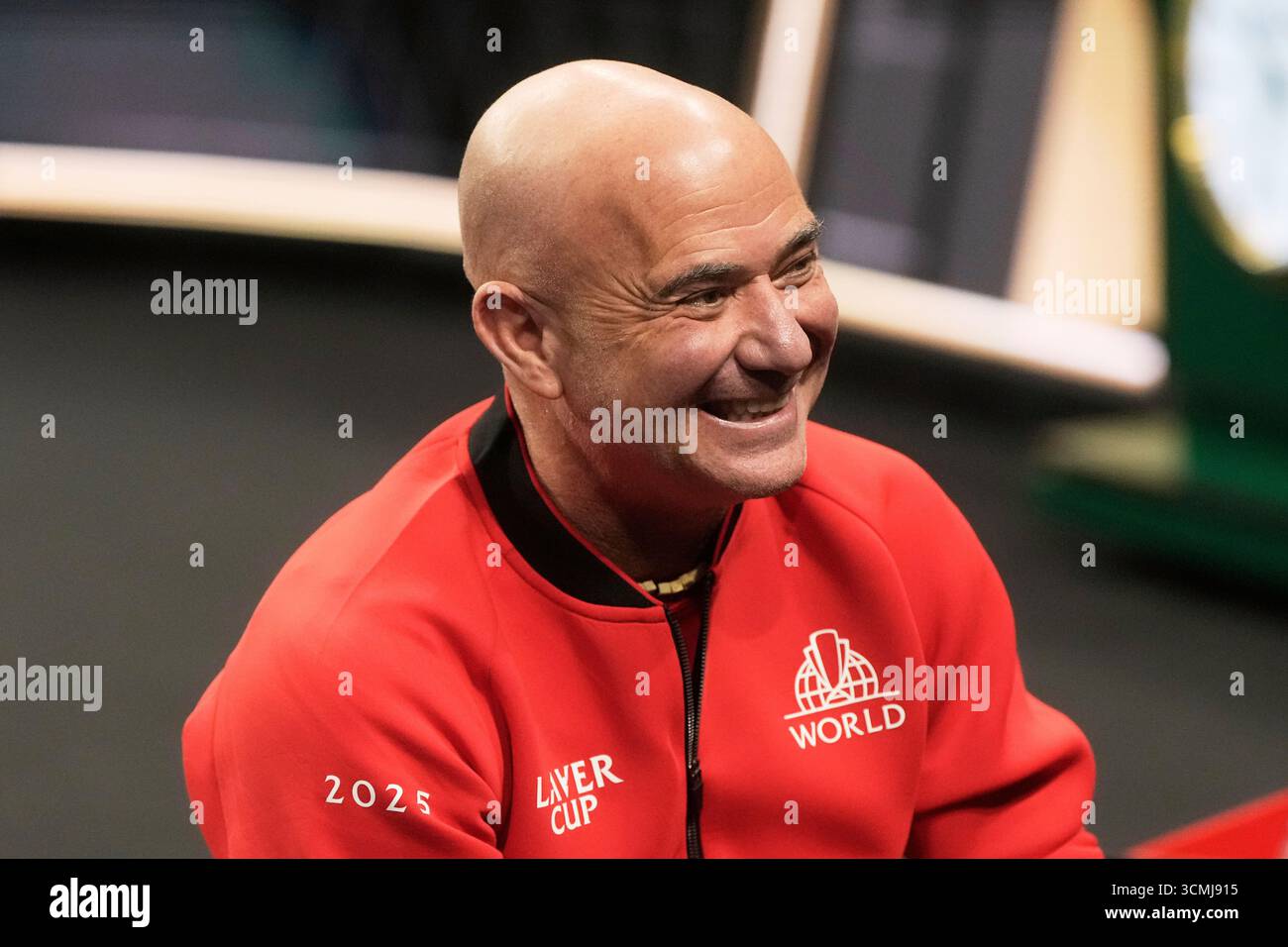 Team World captain Andre Agassi smiles while being interviewed for the ...