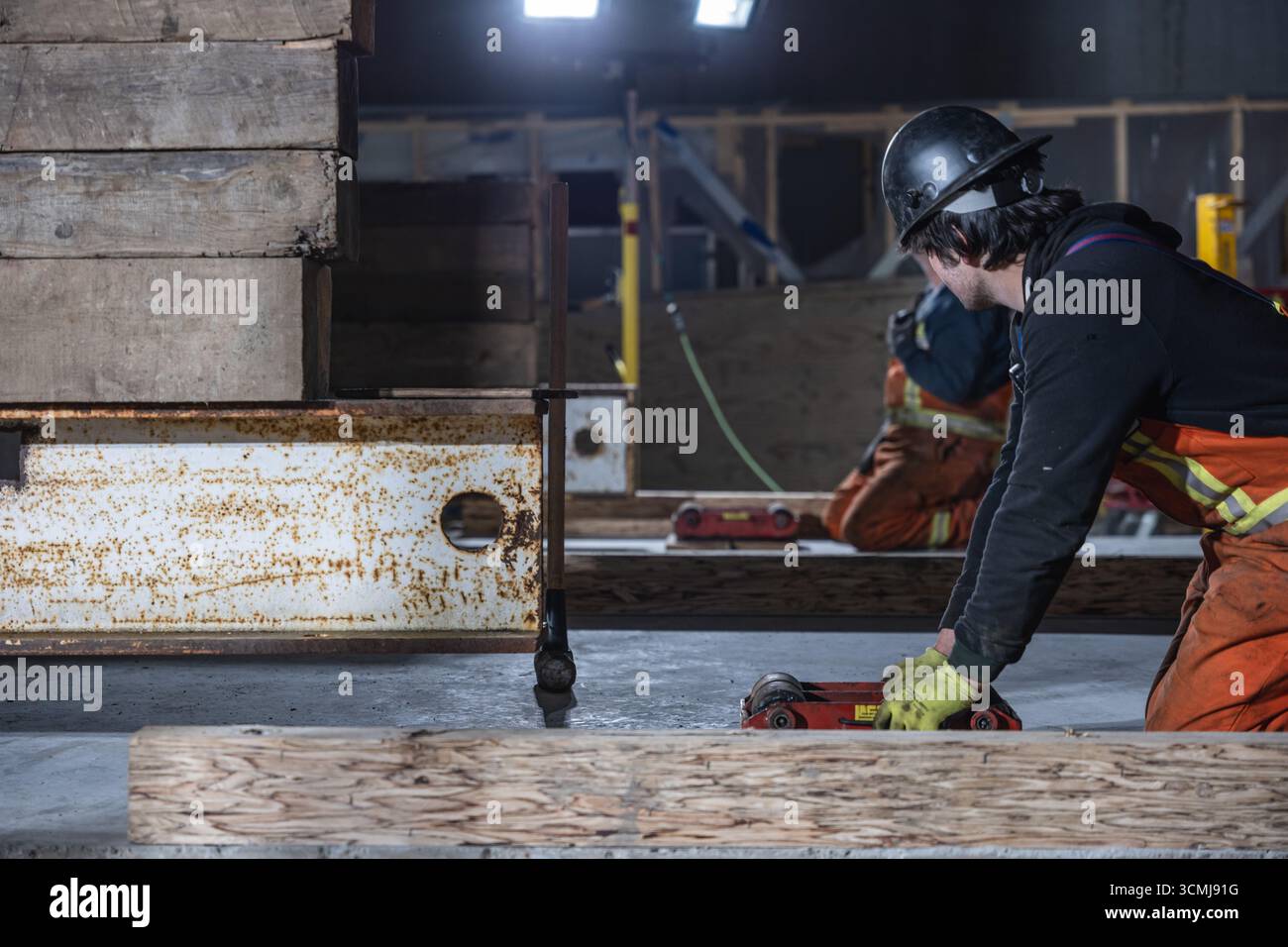 Photo of Worker on a Construction Site Stock Photo - Alamy