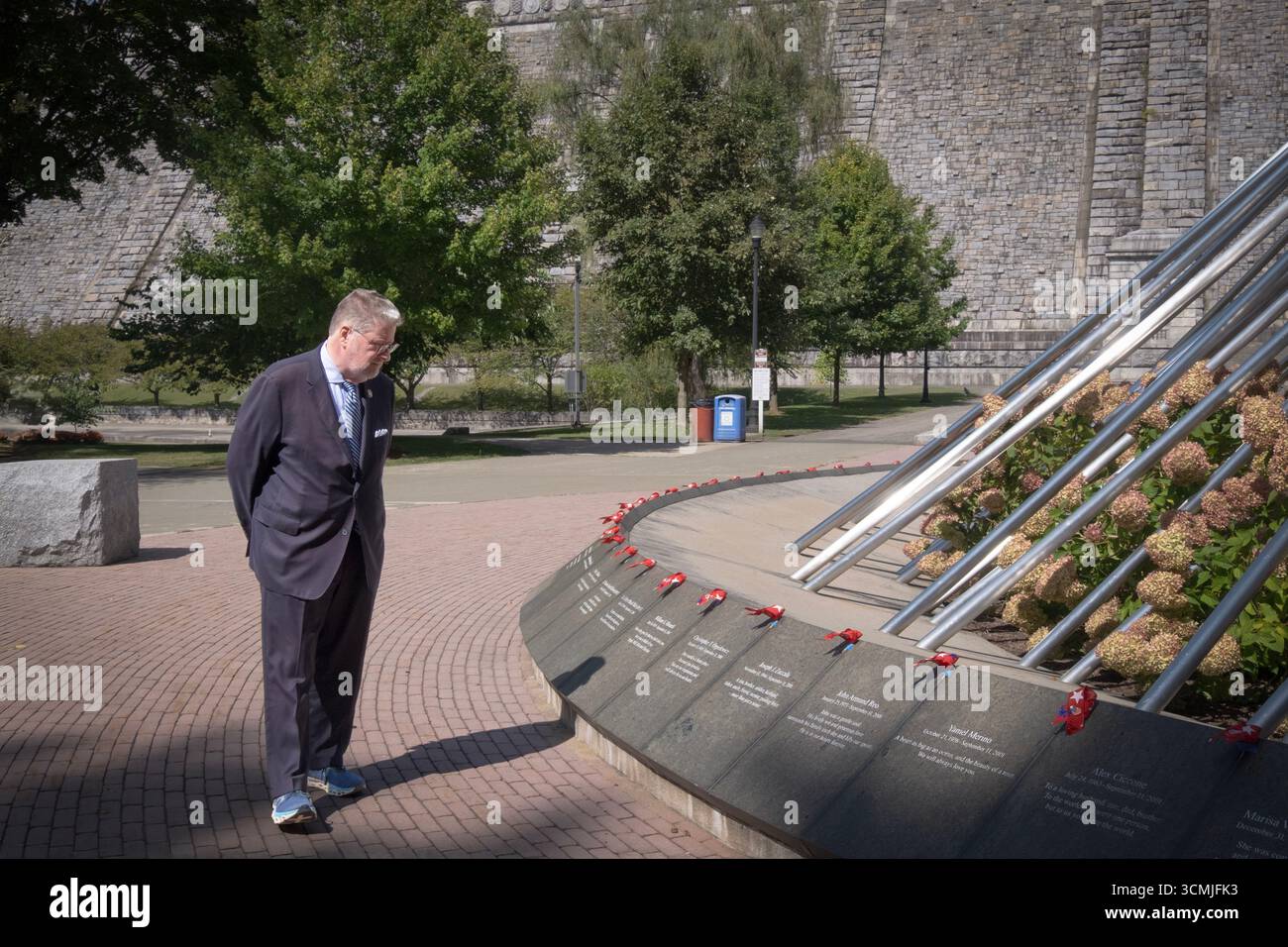 New York State Senator Pete Harkham reading the names of deceased from ...