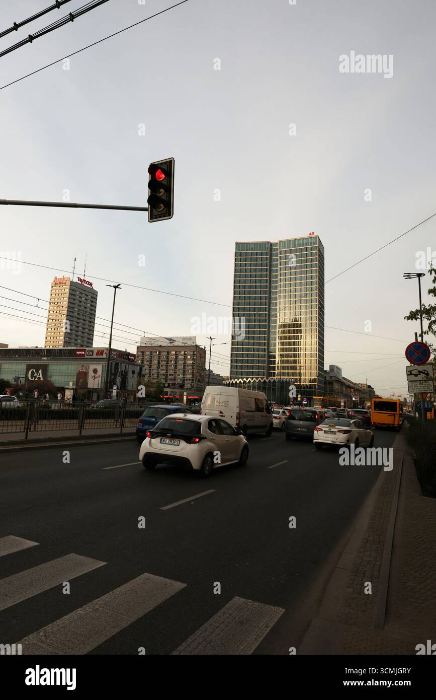 Warsaw city traffic—busy streets, tall office towers, and green traffic ...