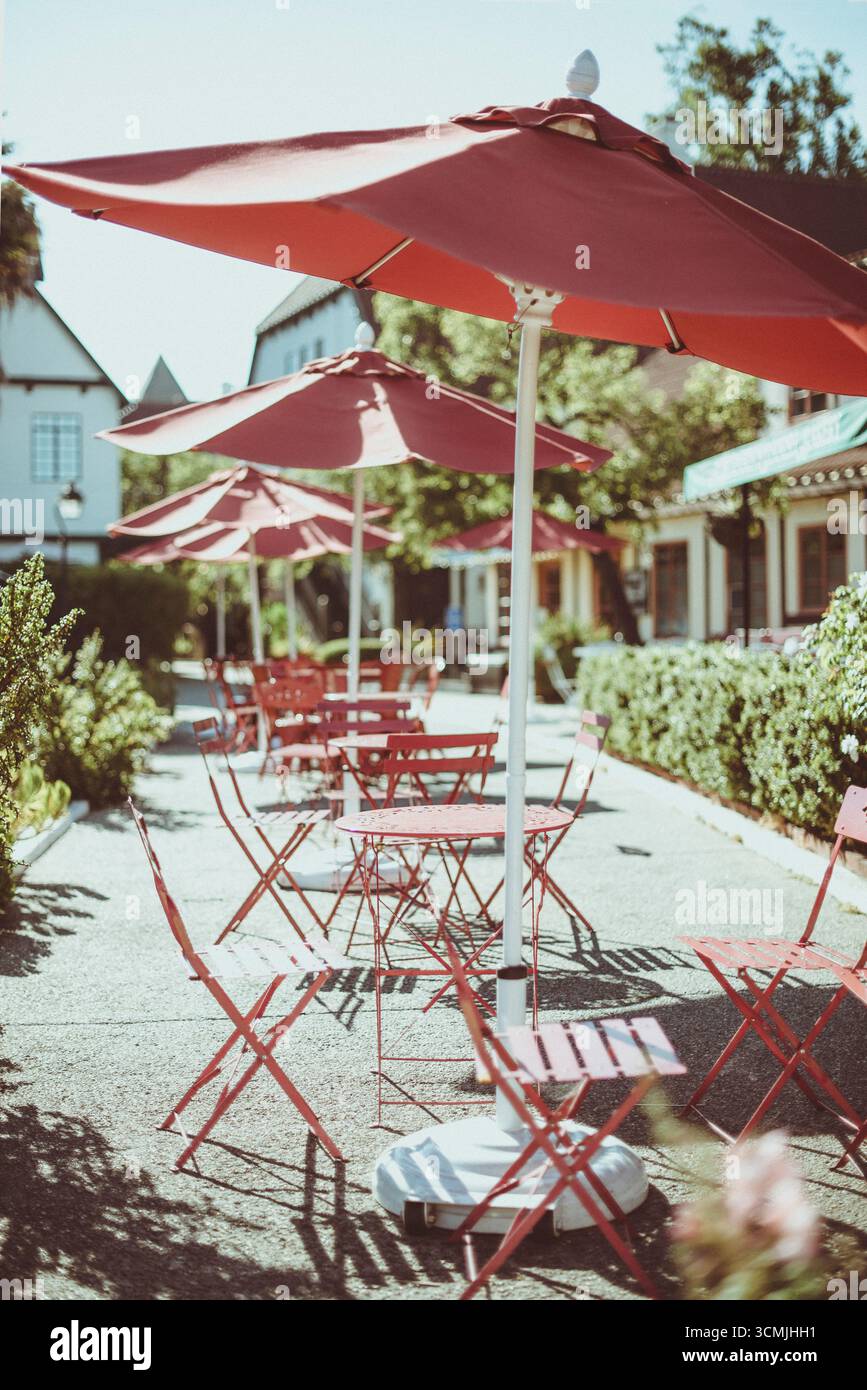 Outdoor metal Garden tables and chairs on a city street in summer ...