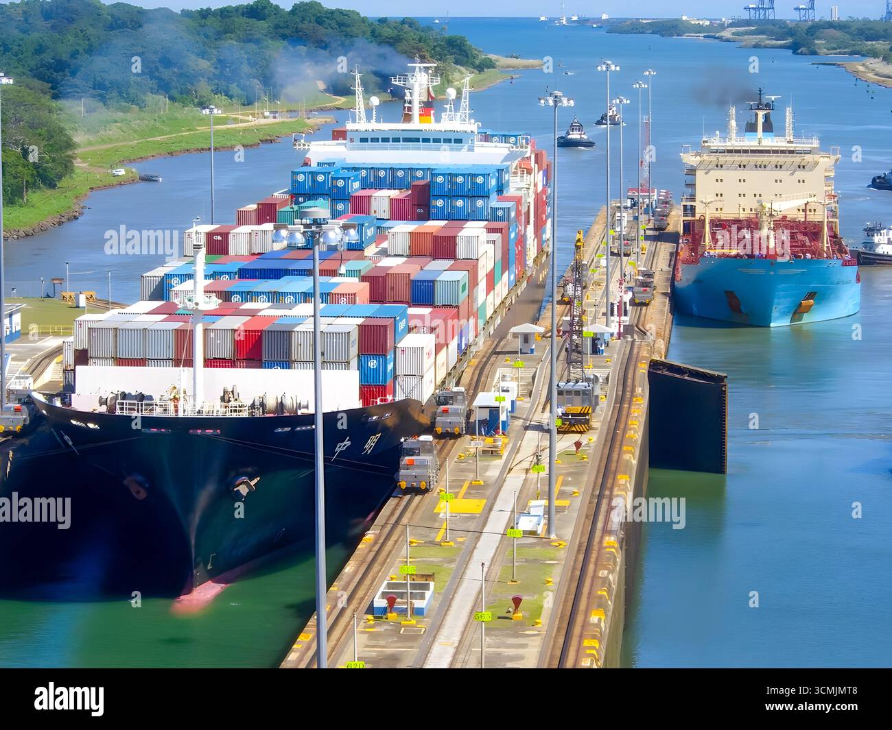 Two massive container ships navigate the narrow confines of the ...