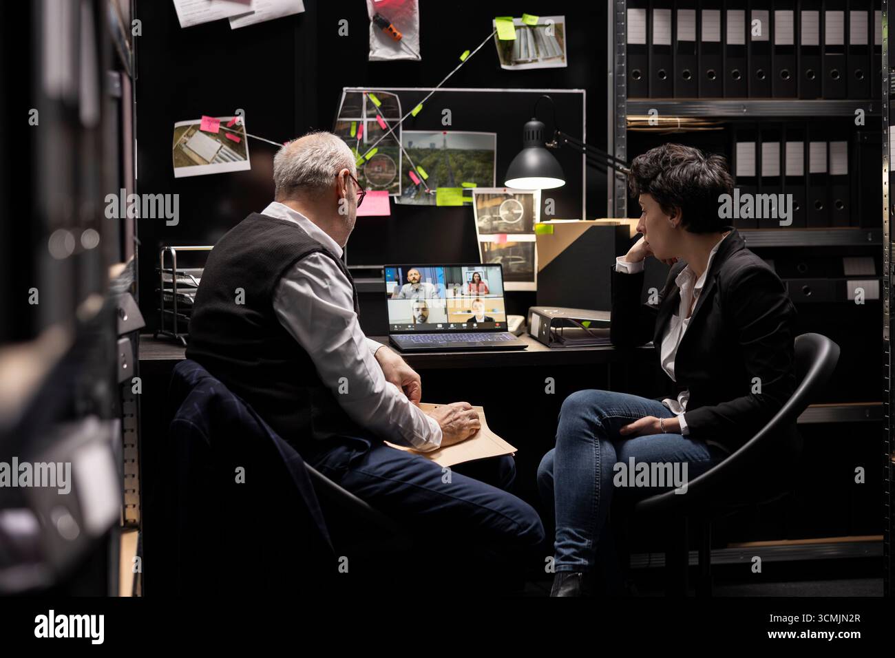 Private detectives discussing clues with remote team on video ...