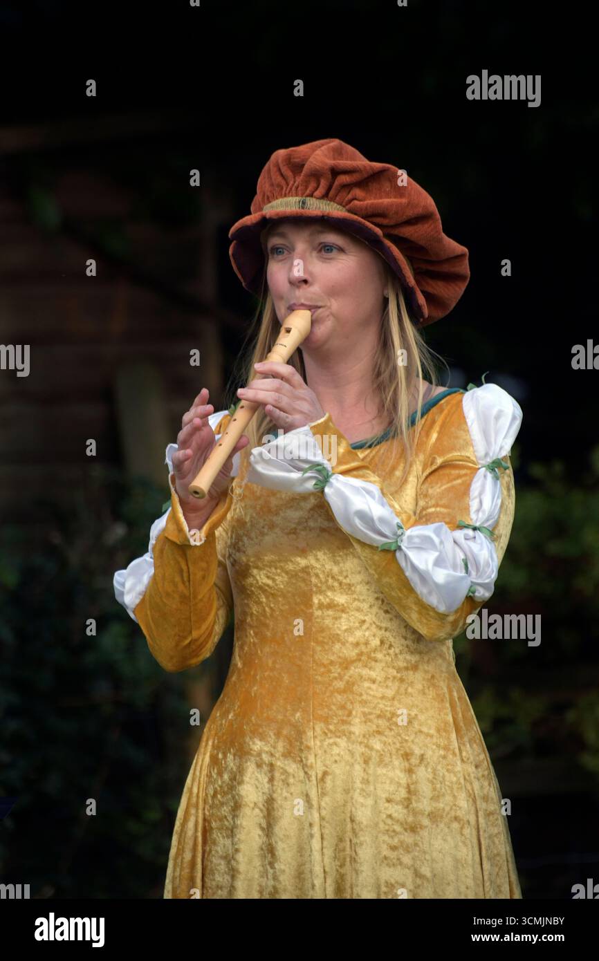 woman in medieval costume playing on recorder, bungay suffolk, england ...