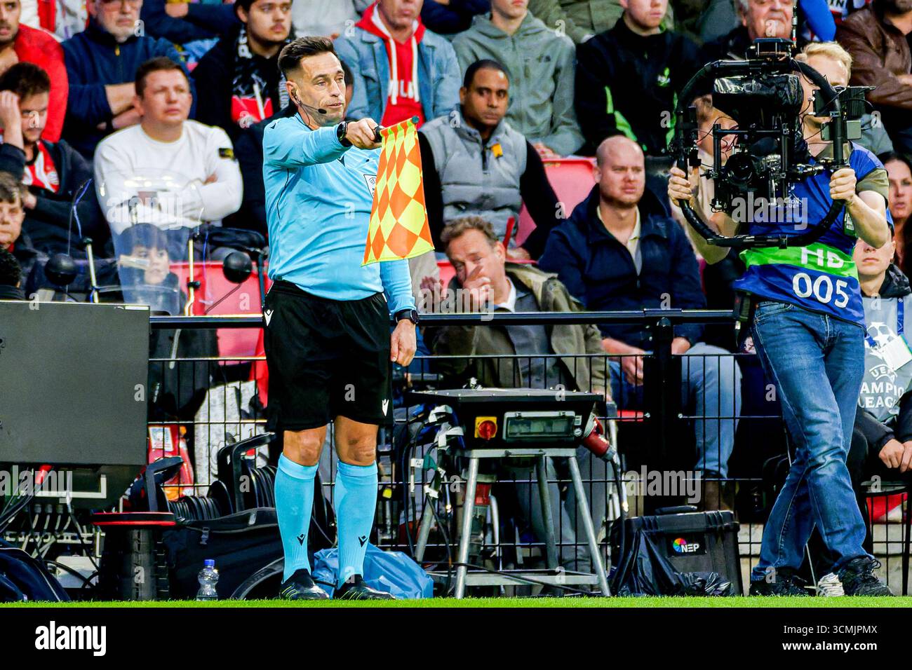 Assistant Referee Gary Beswick gestures during the UEFA Champions ...