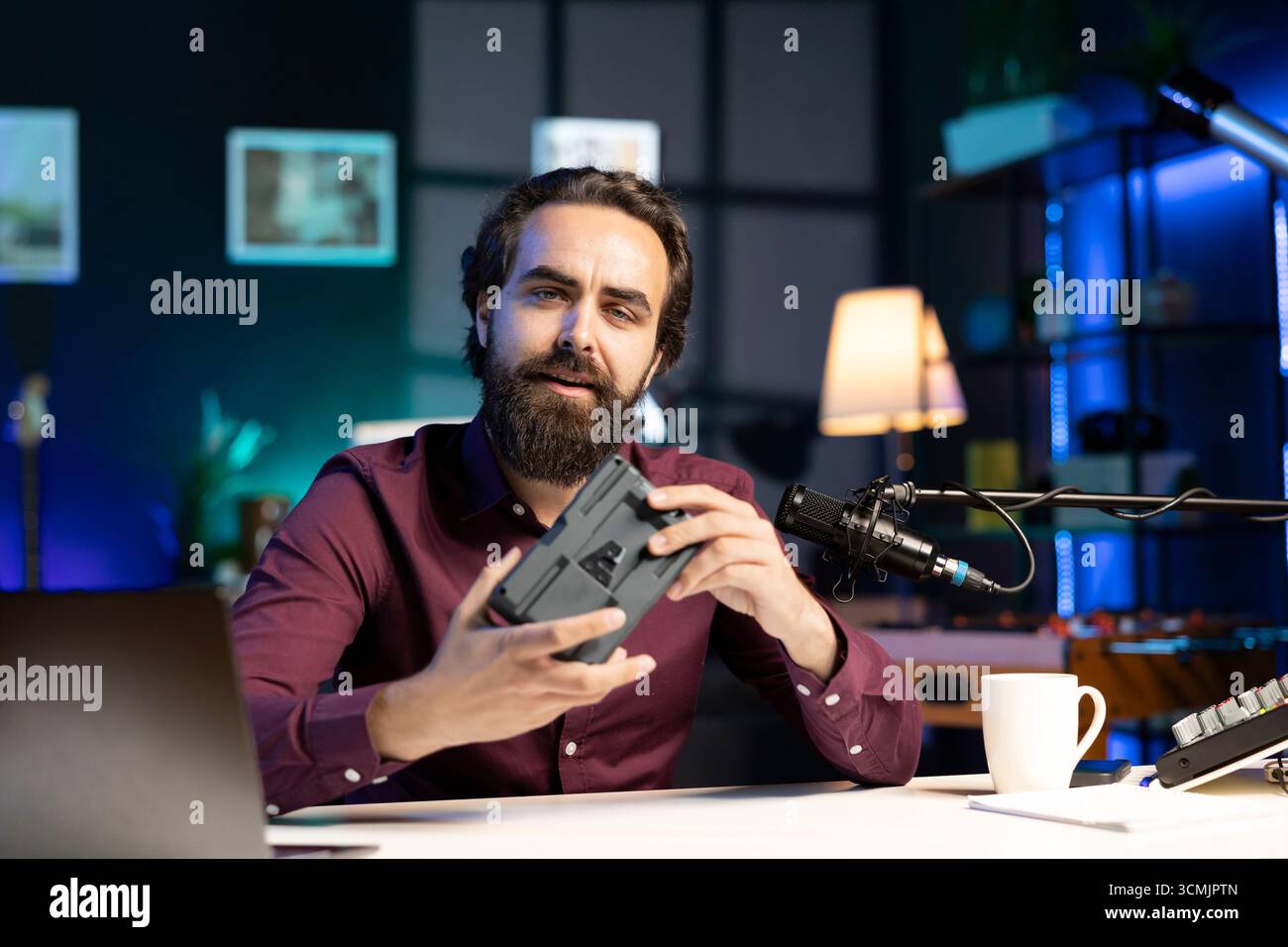 Tech content creator filming technology review of newly released V ...