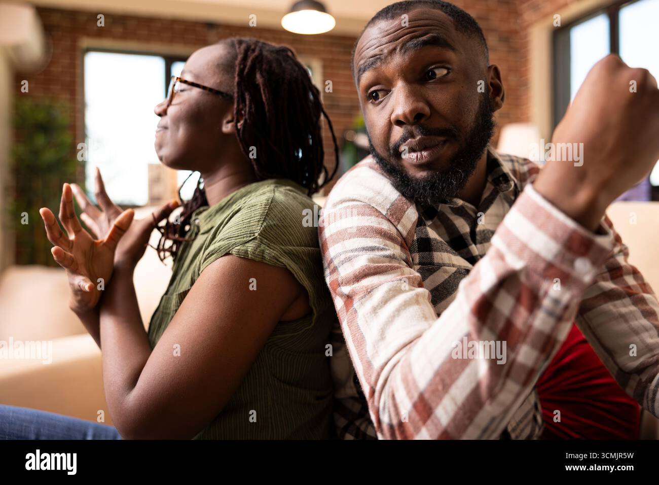 Black couple facing relationship conflict at home. African american woman looks disheartened ...
