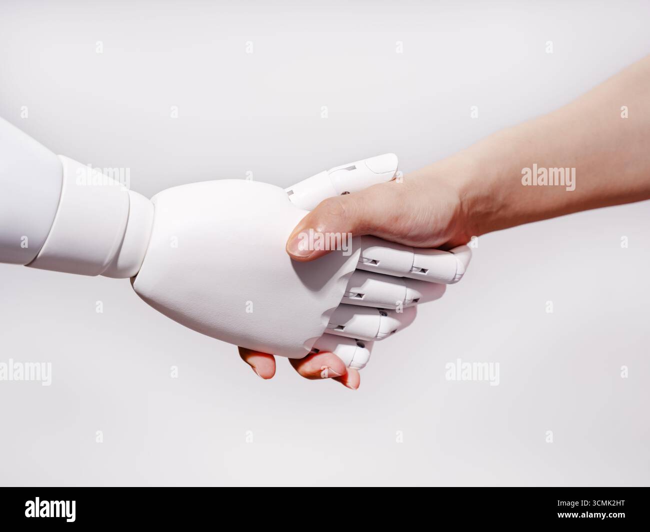 Human hand shakes robot's hand Stock Photo - Alamy