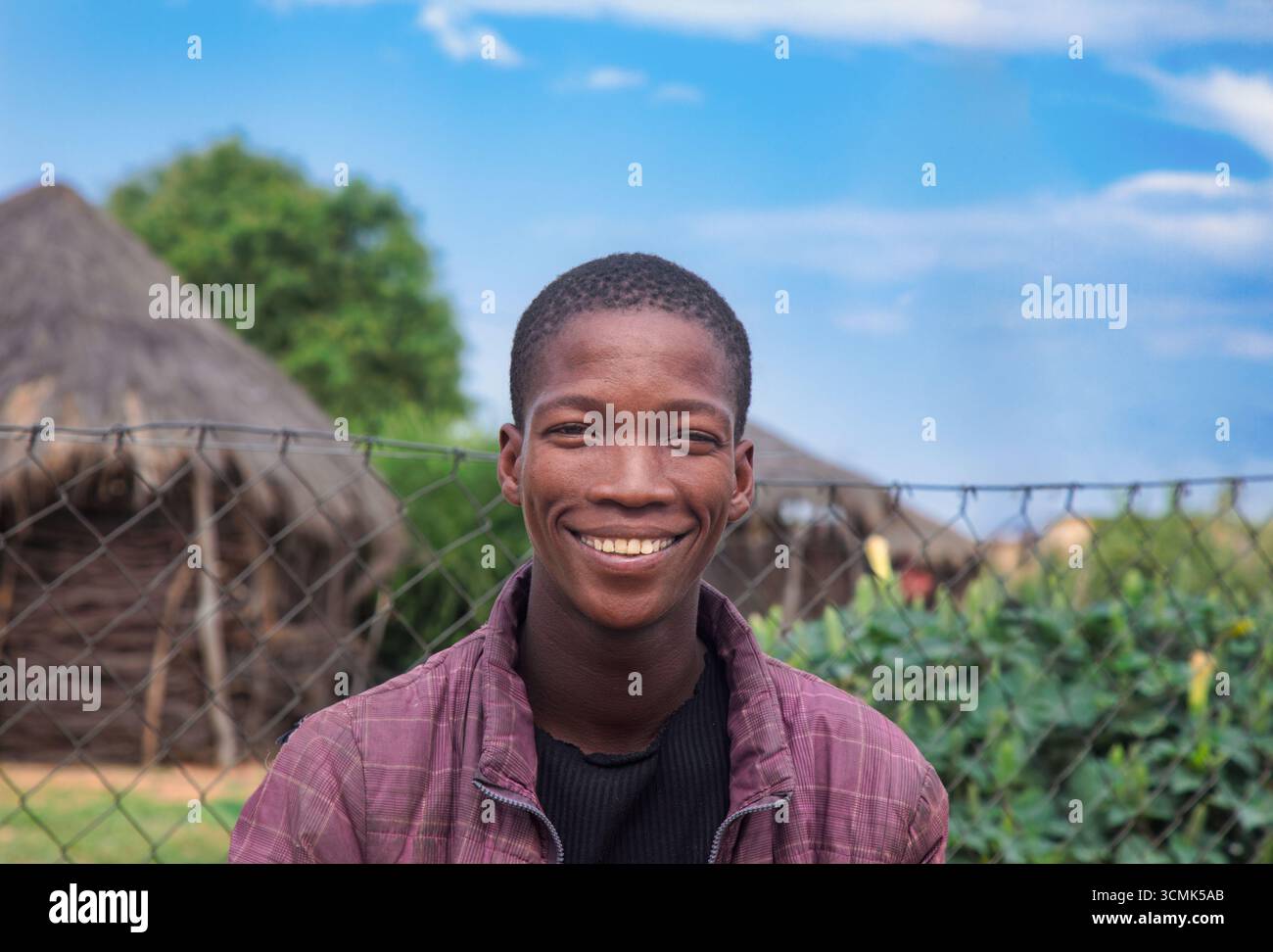 african village african man, in front of house , typical home with ...