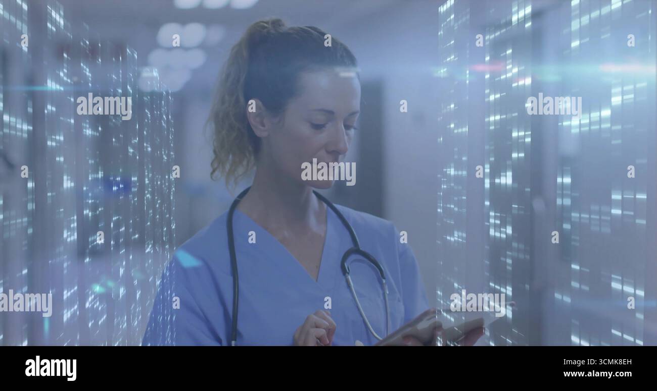 Analyzing nurse wearing scrubs with stethoscope holding tablet with ...