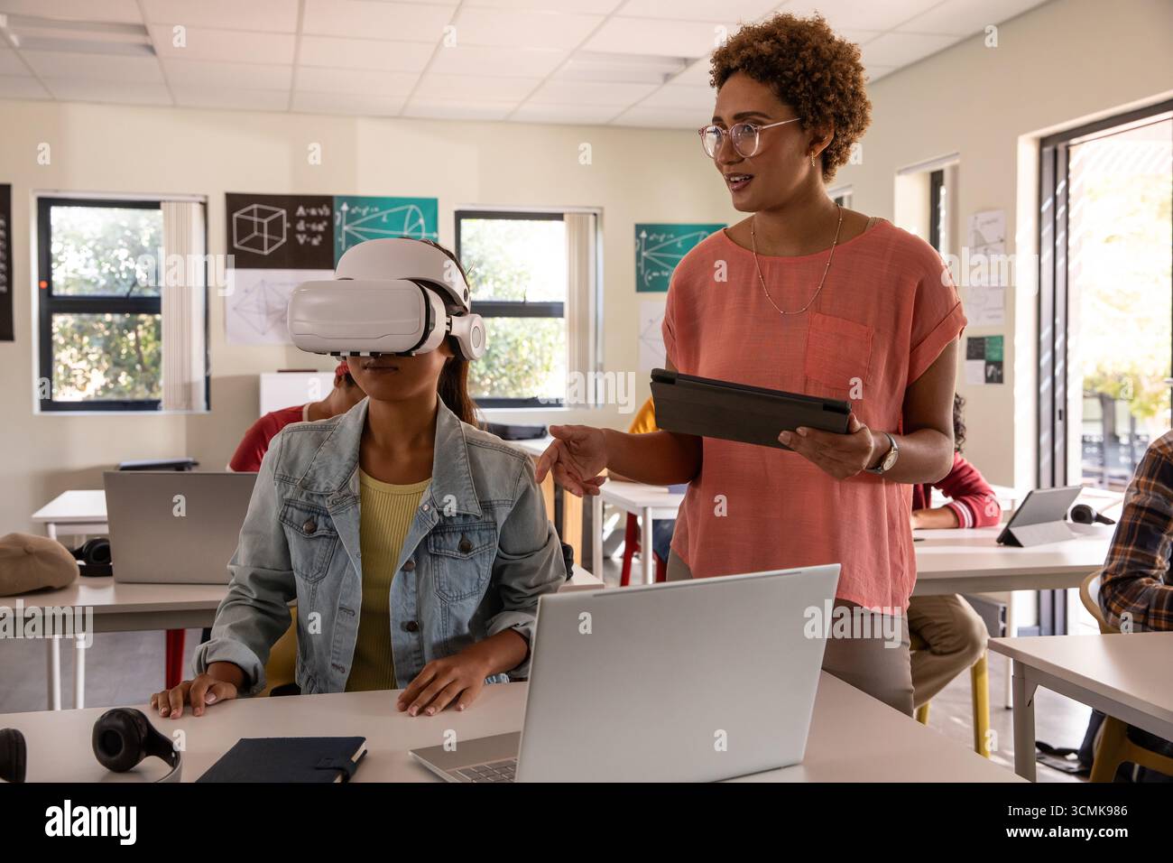 Female instructor tablet guiding hi-res stock photography and images ...