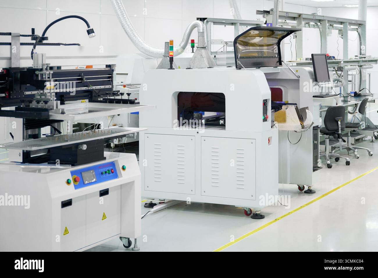 SMT placement machine in a modern electronic manufacturing facility ...