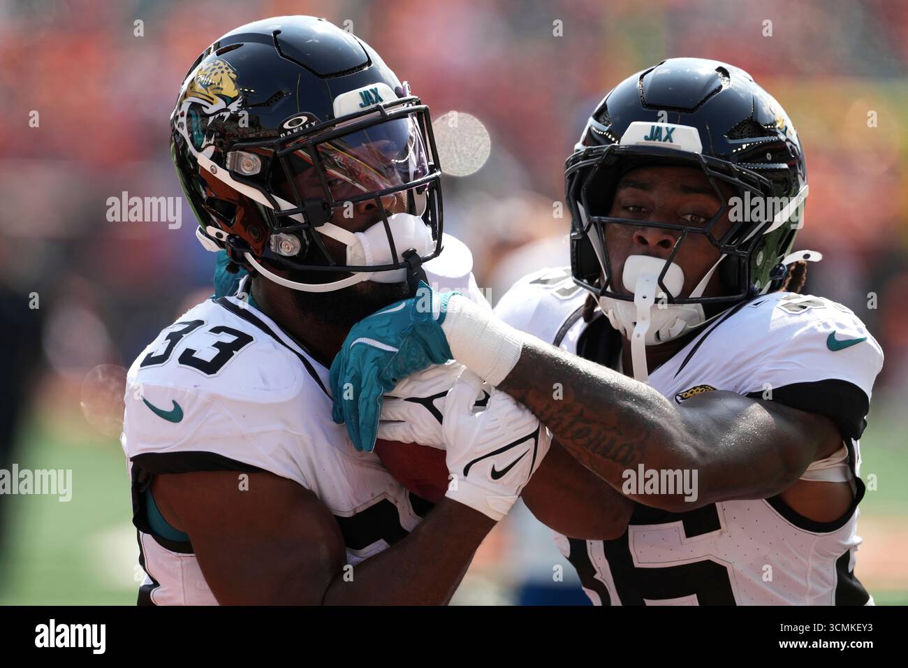 Jacksonville Jaguars running back Bhayshul Tuten, left, and Jacksonville Jaguars running back ...