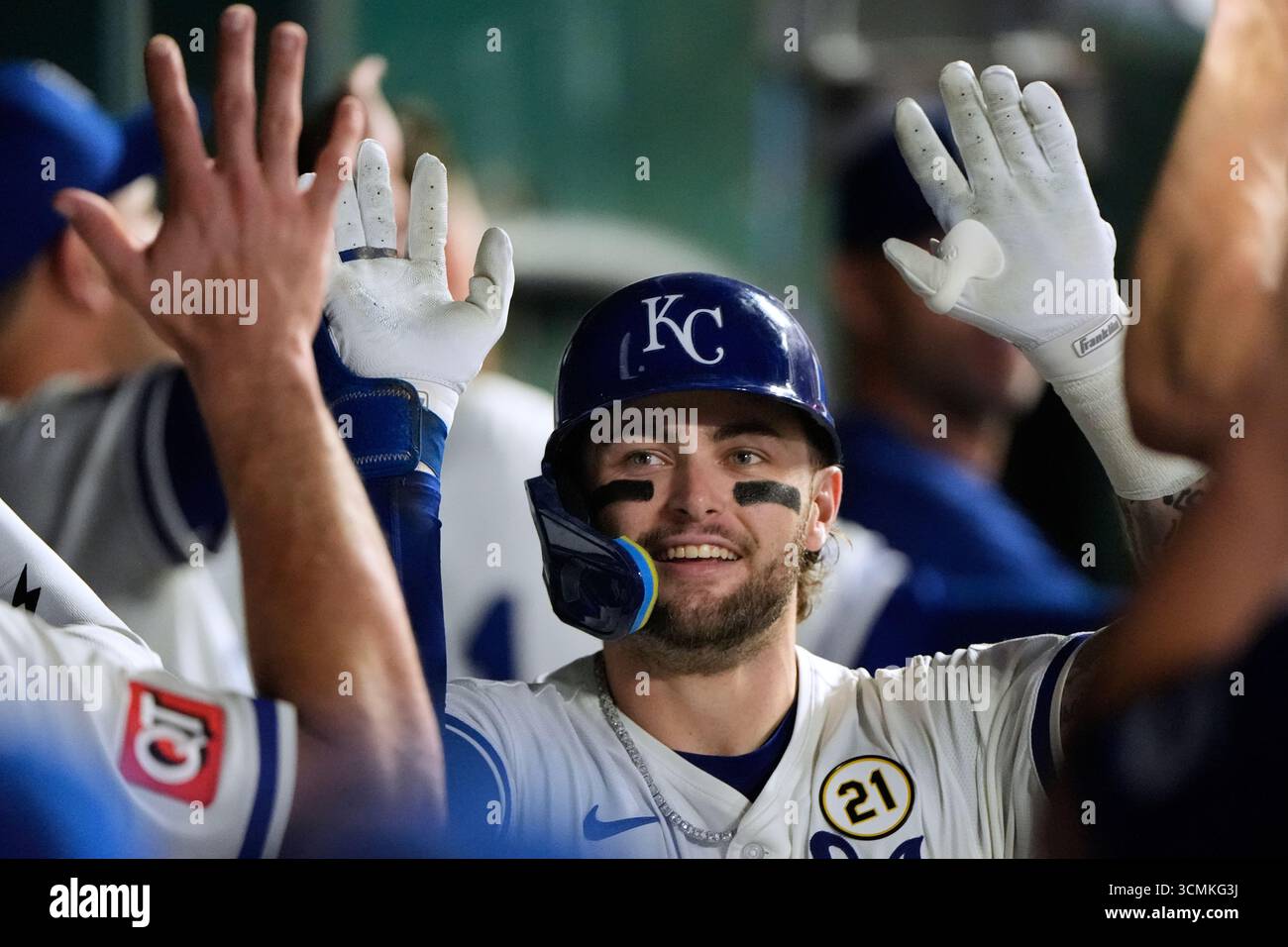 Kansas City Royals' Carter Jensen celebrates in the dugout after ...