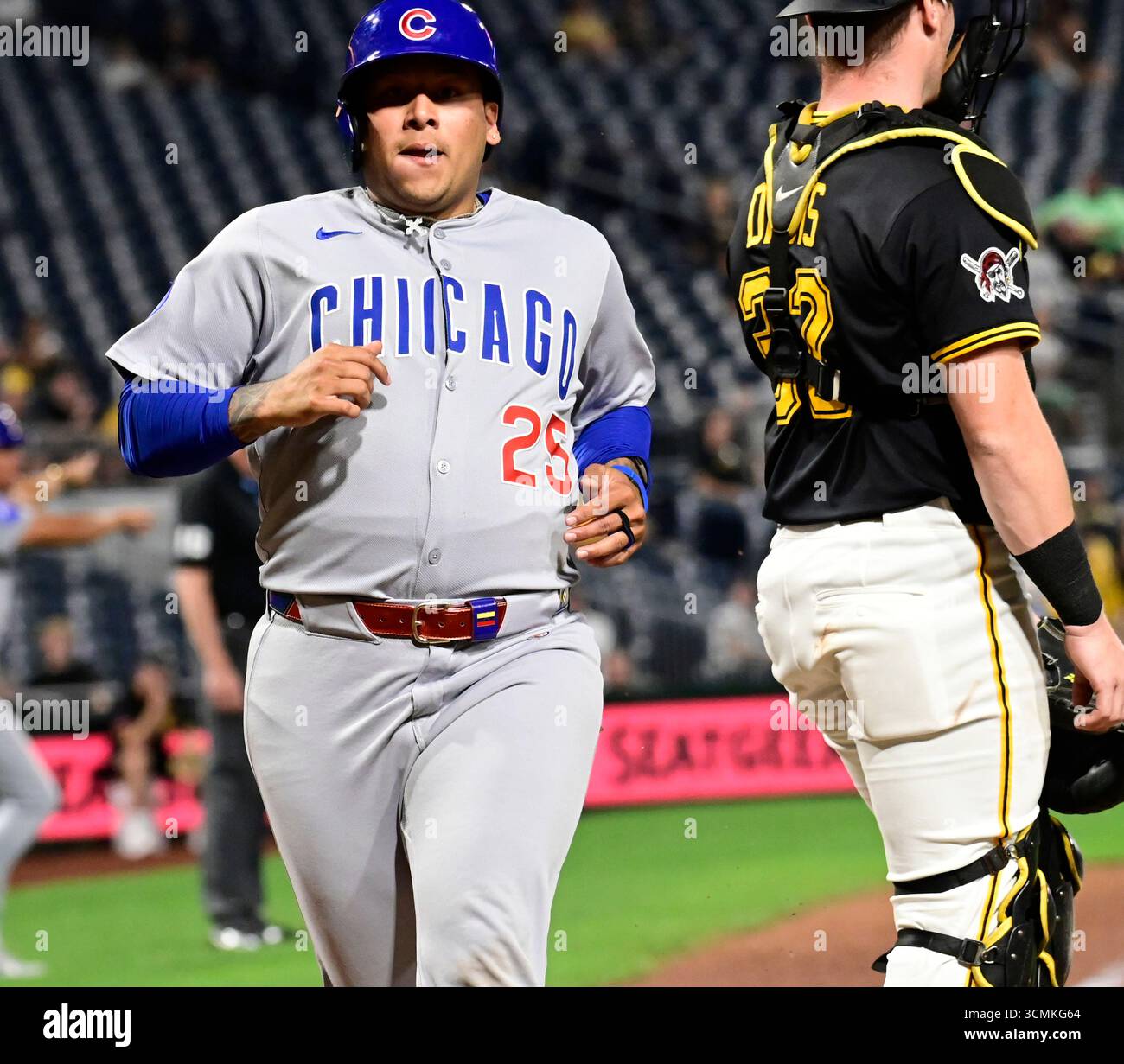 Chicago Cubs catcher Moisés Ballesteros (25) scores on a sacrifice fly ...
