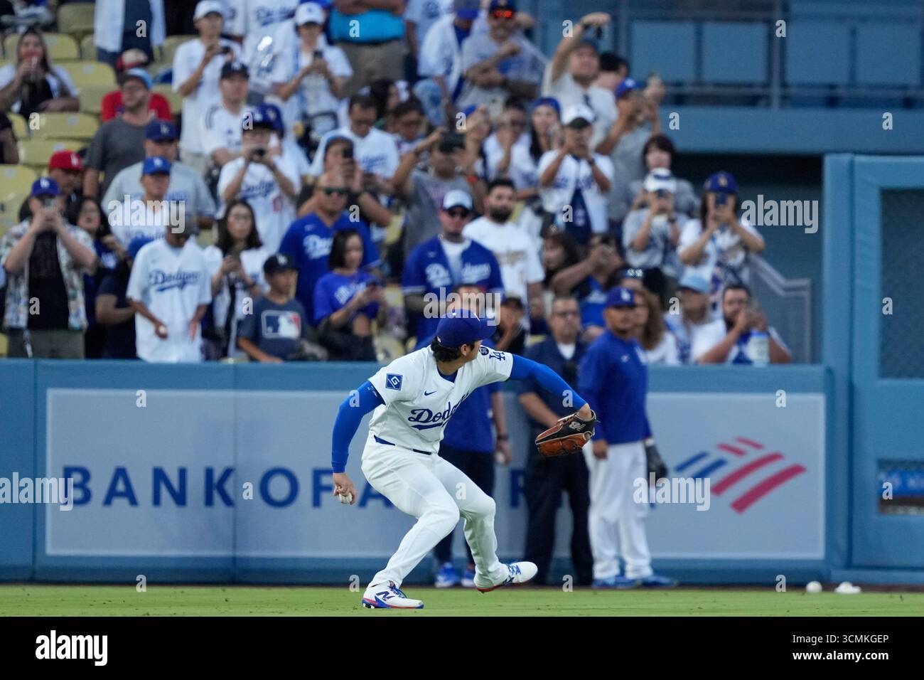 Los Angeles Dodgers starting pitcher Shohei Ohtani warms up before a ...