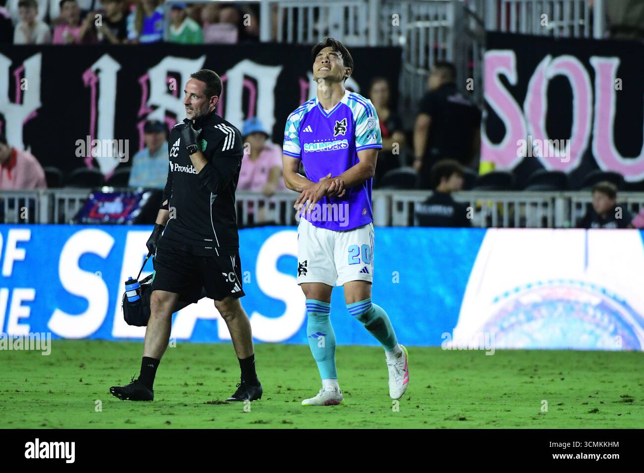 Seattle Sounders defender Kim Kee-Hee (20) walks off the pitch in pain ...