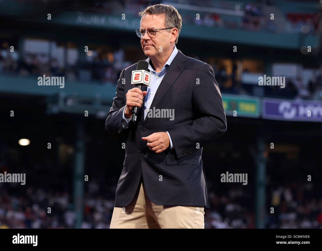 ESPN reporter Buster Olney is shown doing a pregame report on the field ...