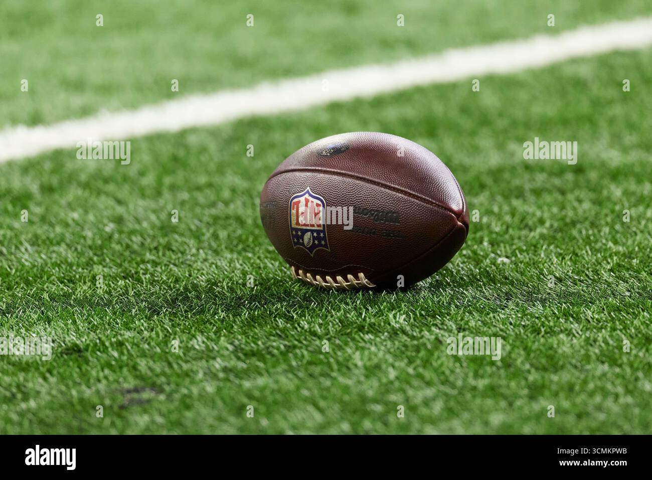Football on the field during an NFL football game between the Chicago ...