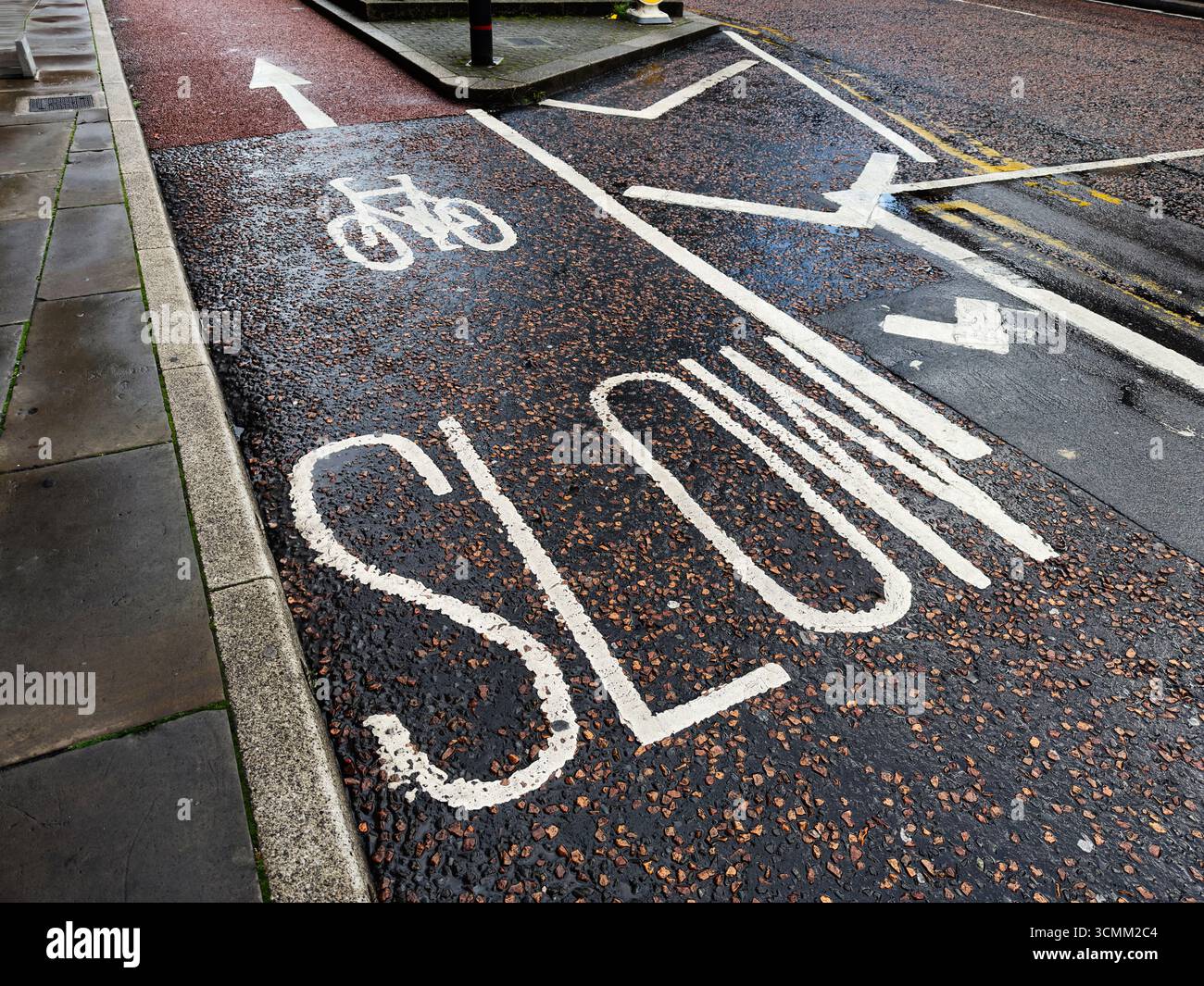 A road in Manchester, UK, displaying clear bike lane and slow traffic ...