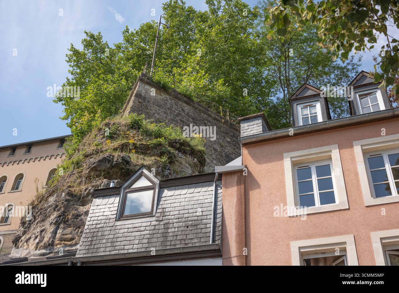 Typical old buildings with roof windows under the cliff in Luxembourg ...