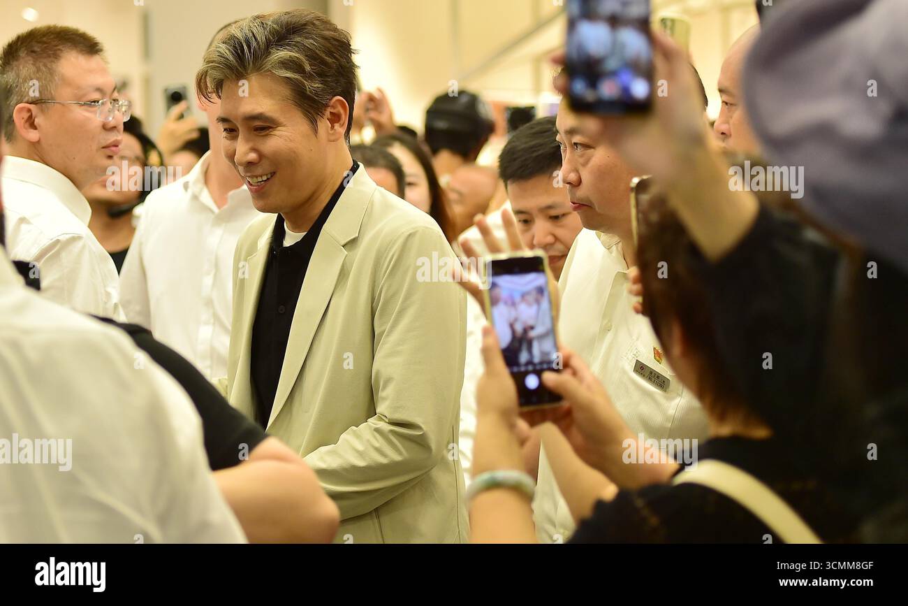Chinese actor Li Naiwen attends an activity in Shenyang City, northeast ...