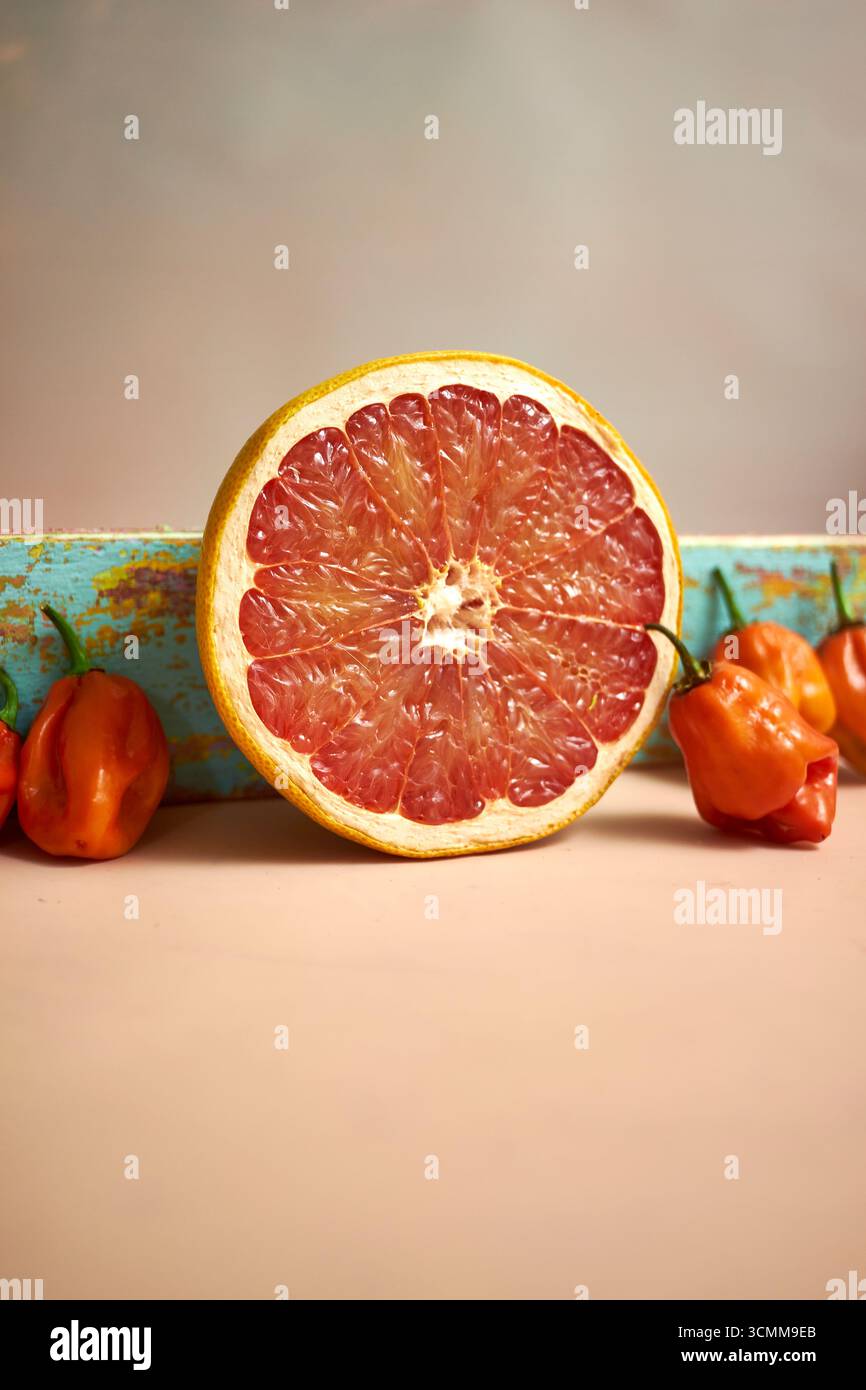 Creative still life with fresh fruits and vegetables – grapefruit, kiwi ...