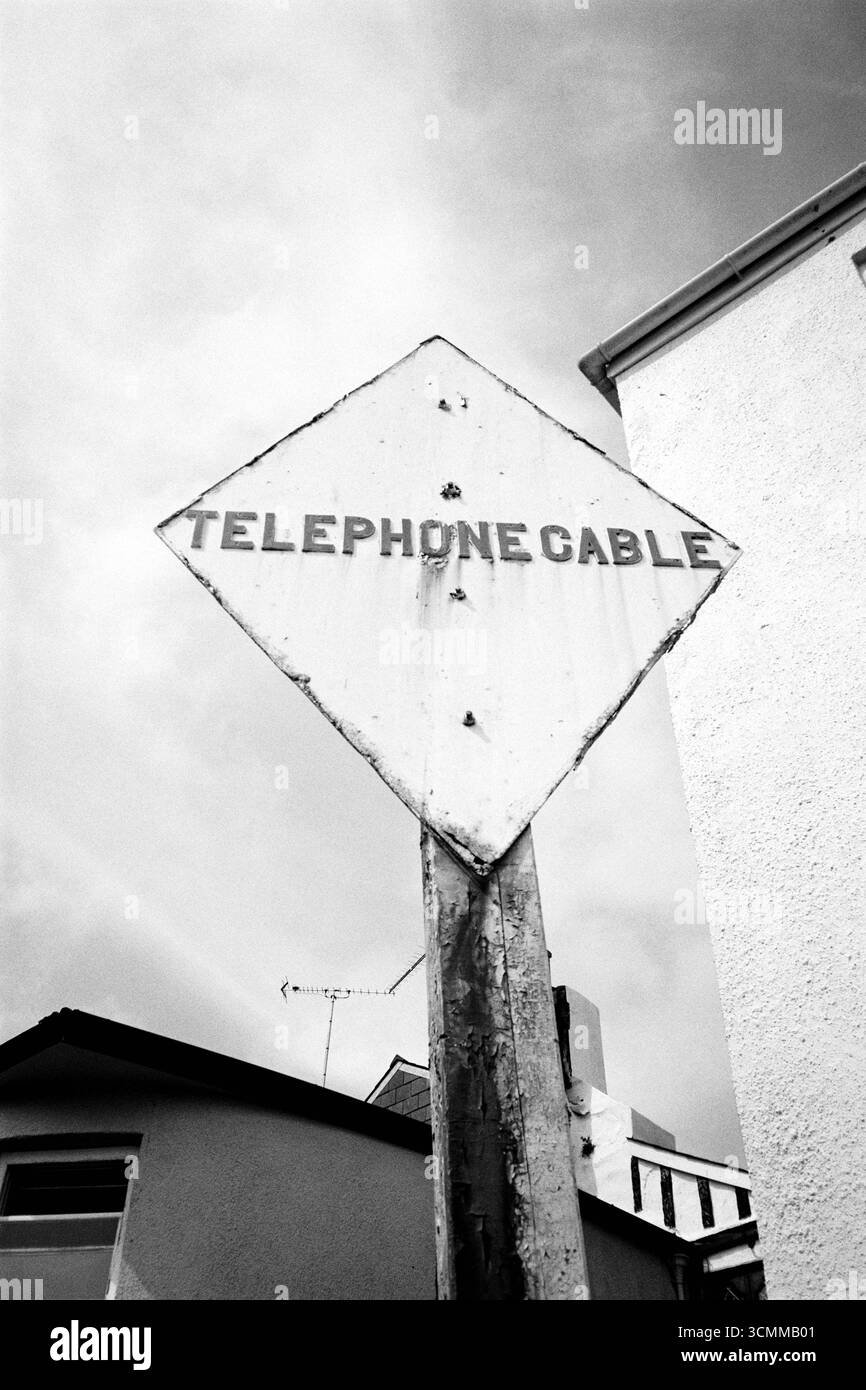 Sign marking the location of an underwater telephone cable, Bayards ...