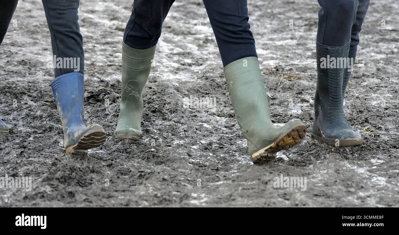 People walking in muddy conditions during the National Ploughing ...