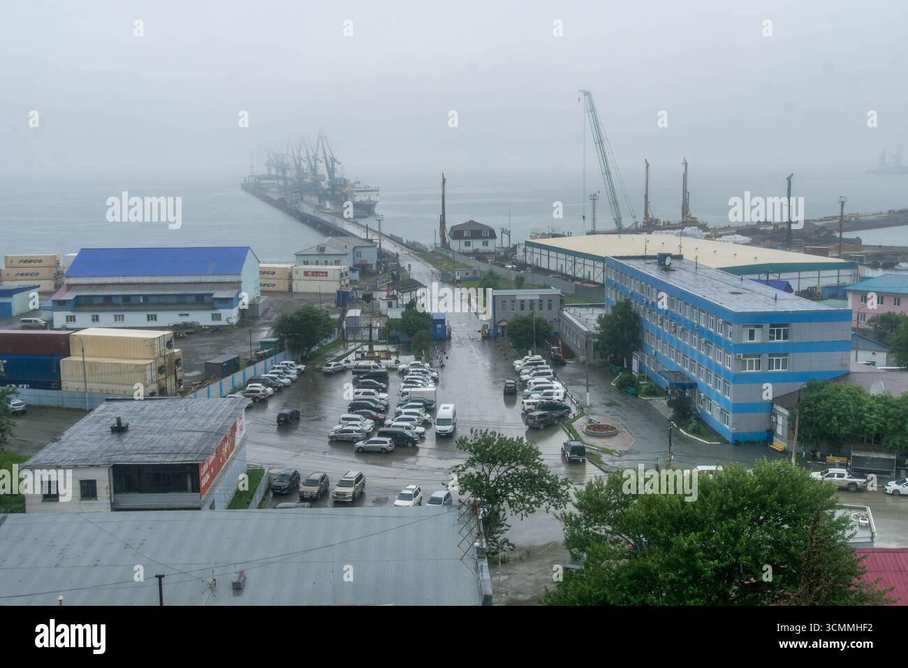 Port entrance in Korsakov, Sakhalin Island, Russia, with cargo ...