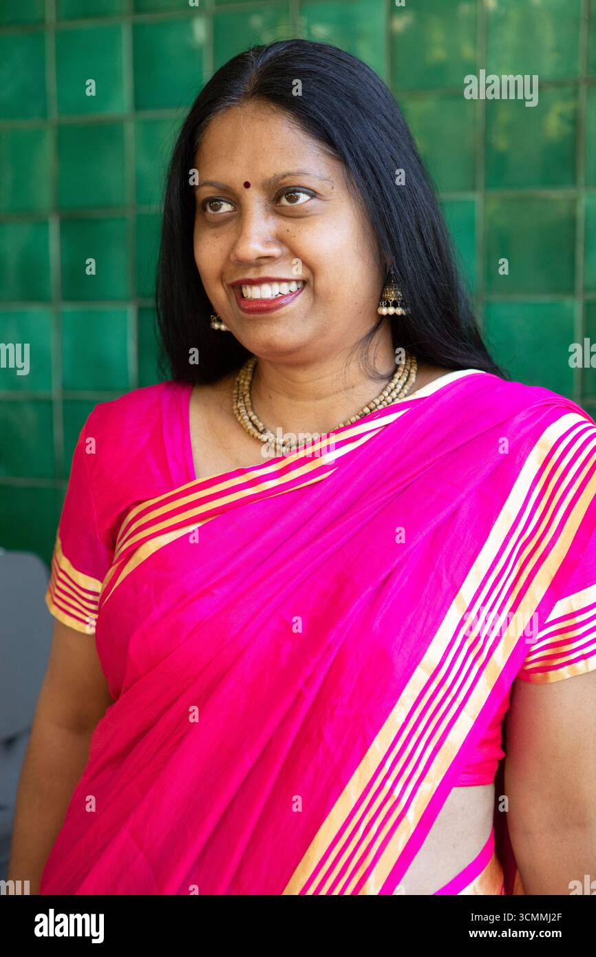 Cheerful woman in green saree hi-res stock photography and images - Alamy