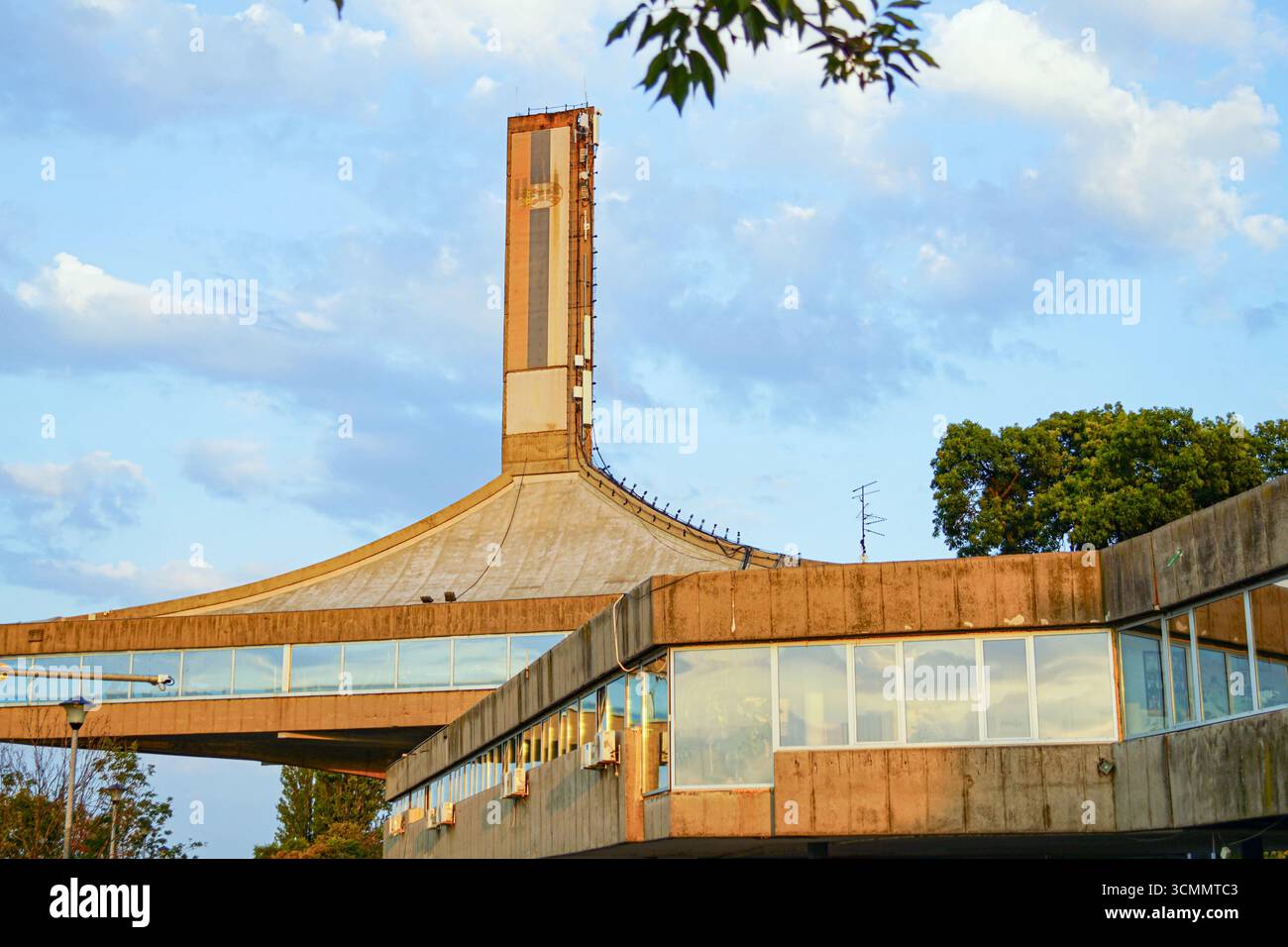 Warm sunlight on brutalist architecture: Belgrade 25 May Sportcenter ...