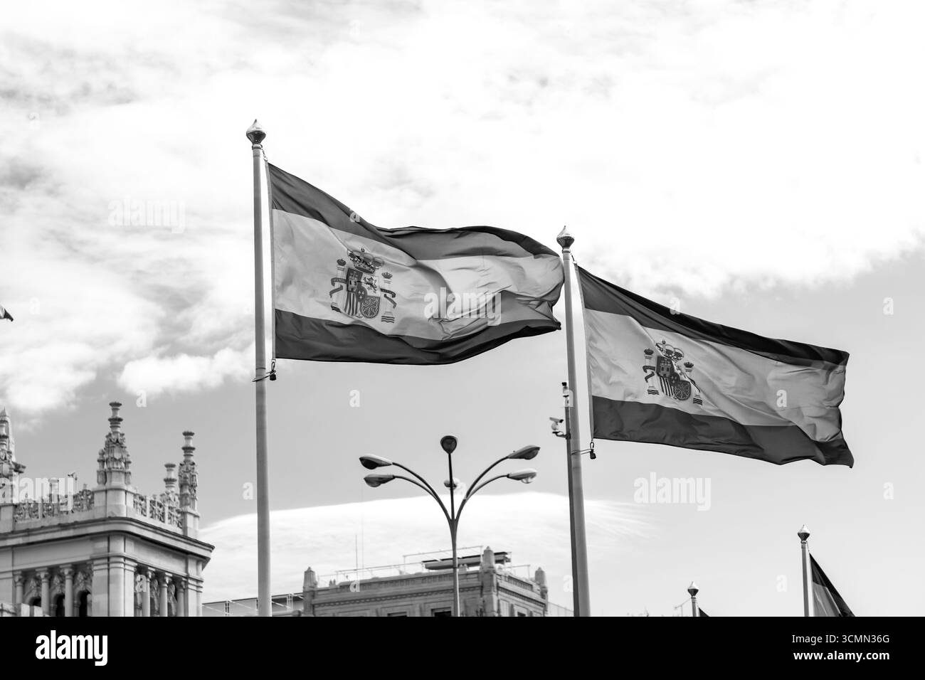 Spanish flag waving on a pole in Madrid, Spain Stock Photo - Alamy