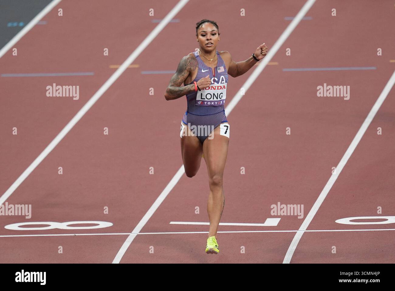 United States' Mckenzie Long crosses the finish line to win the women's ...