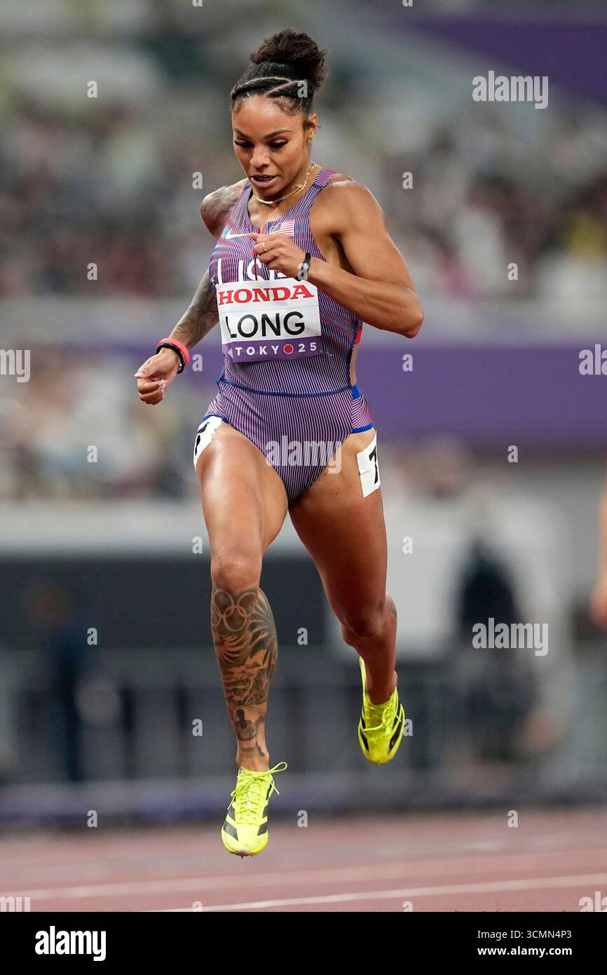 United States' Mckenzie Long crosses the line to finish a women's 200 ...