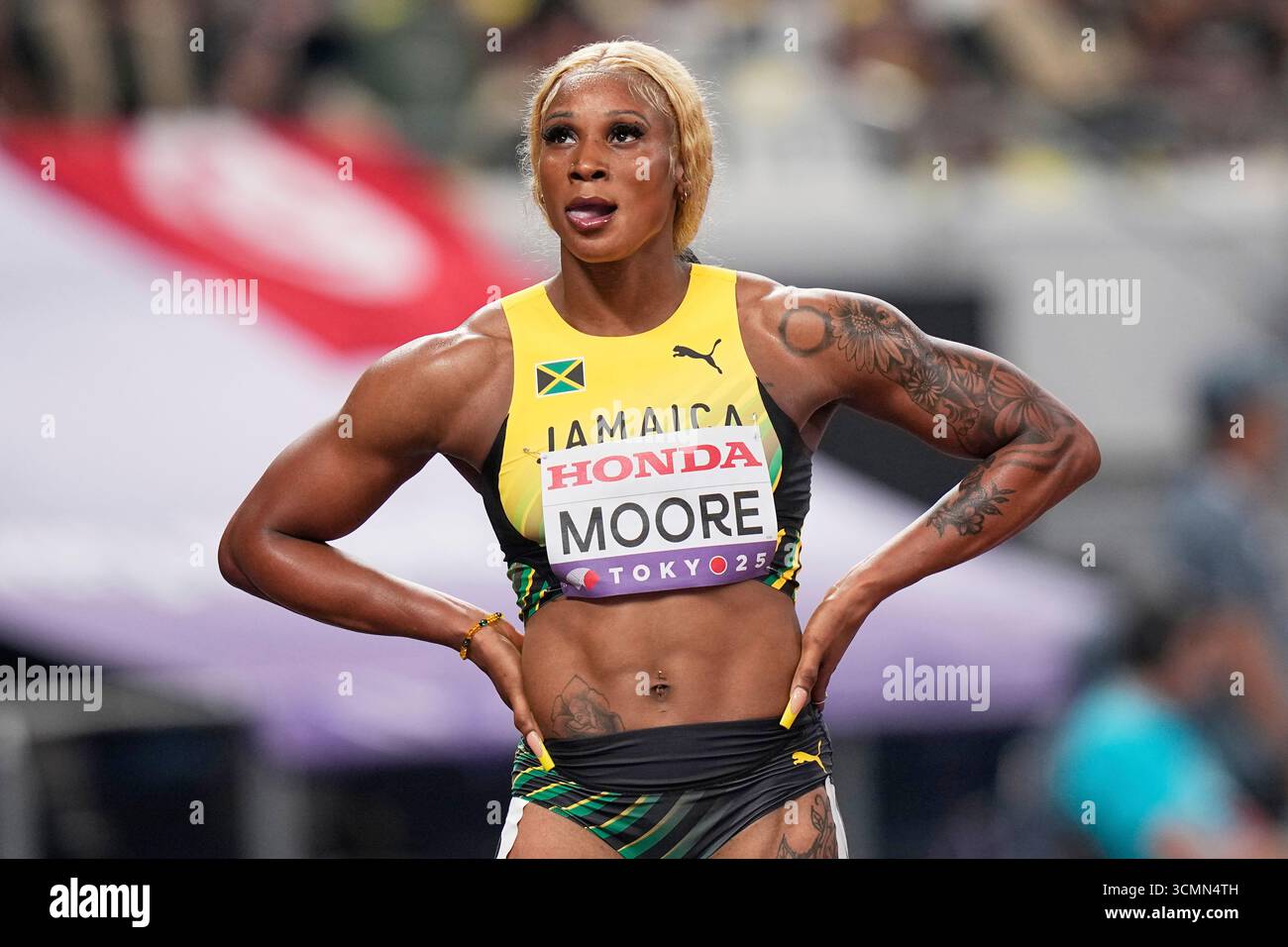 Jamaica's Ashanti Moore reacts during women's 200 meters heat at the ...