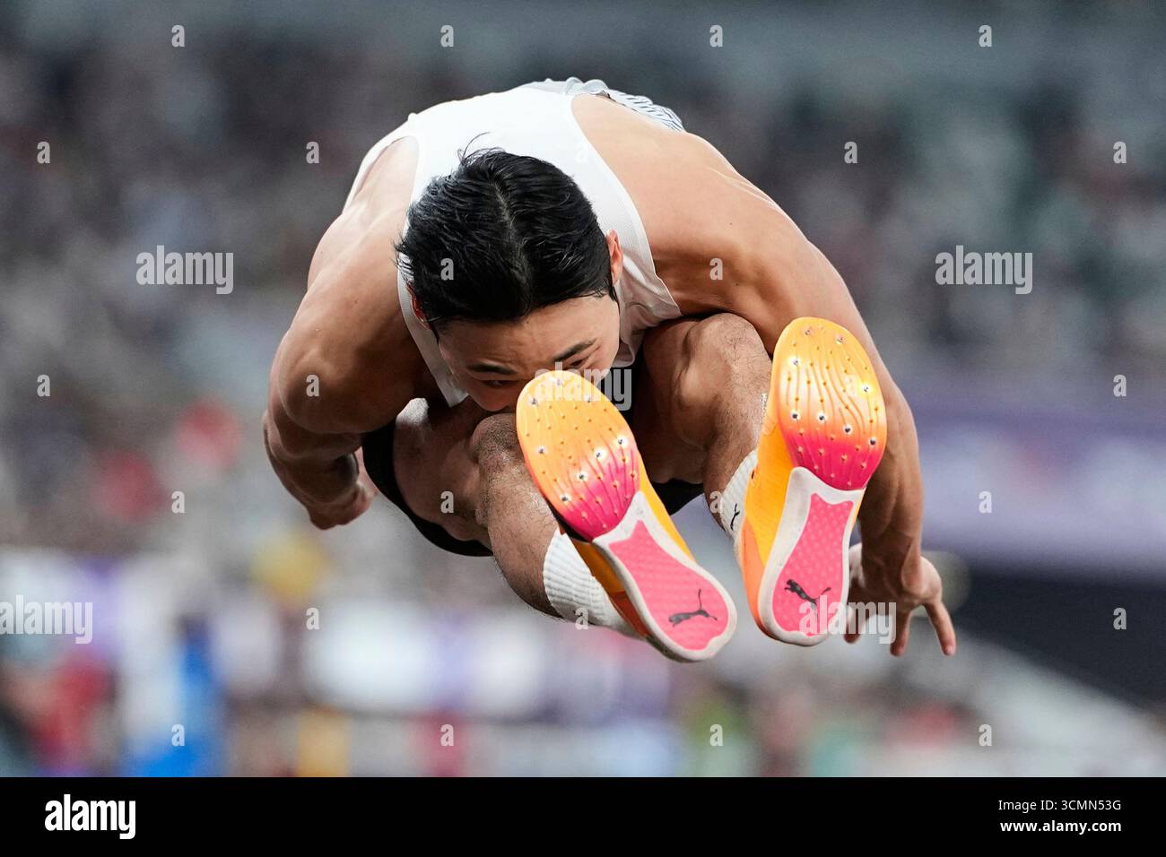 South Korea's Yu Gyu-min competes in the men's triple jump ...