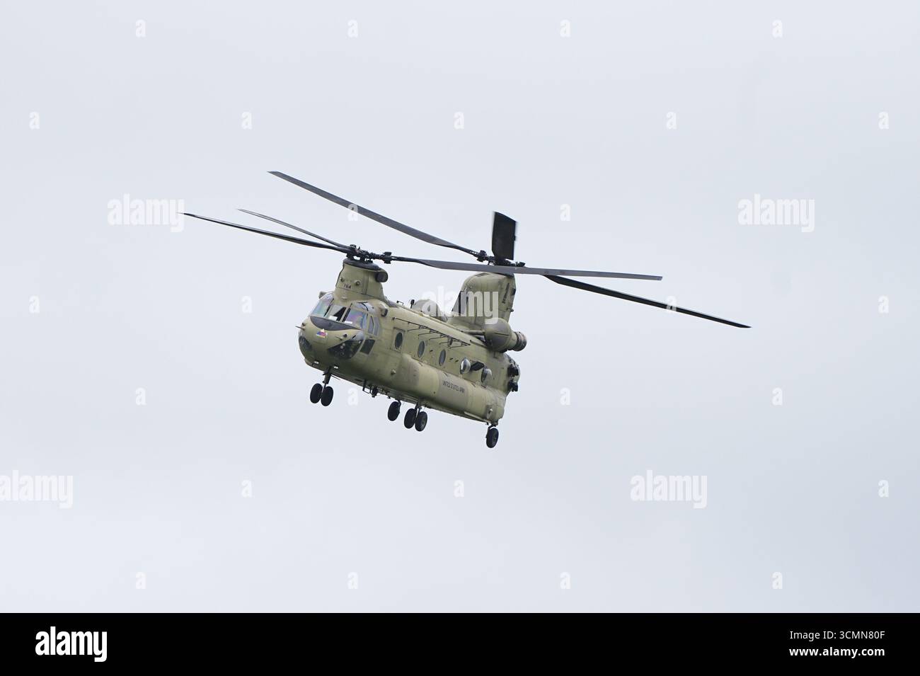 A Chinook lands ahead of the arrival of US President Donald Trump and ...