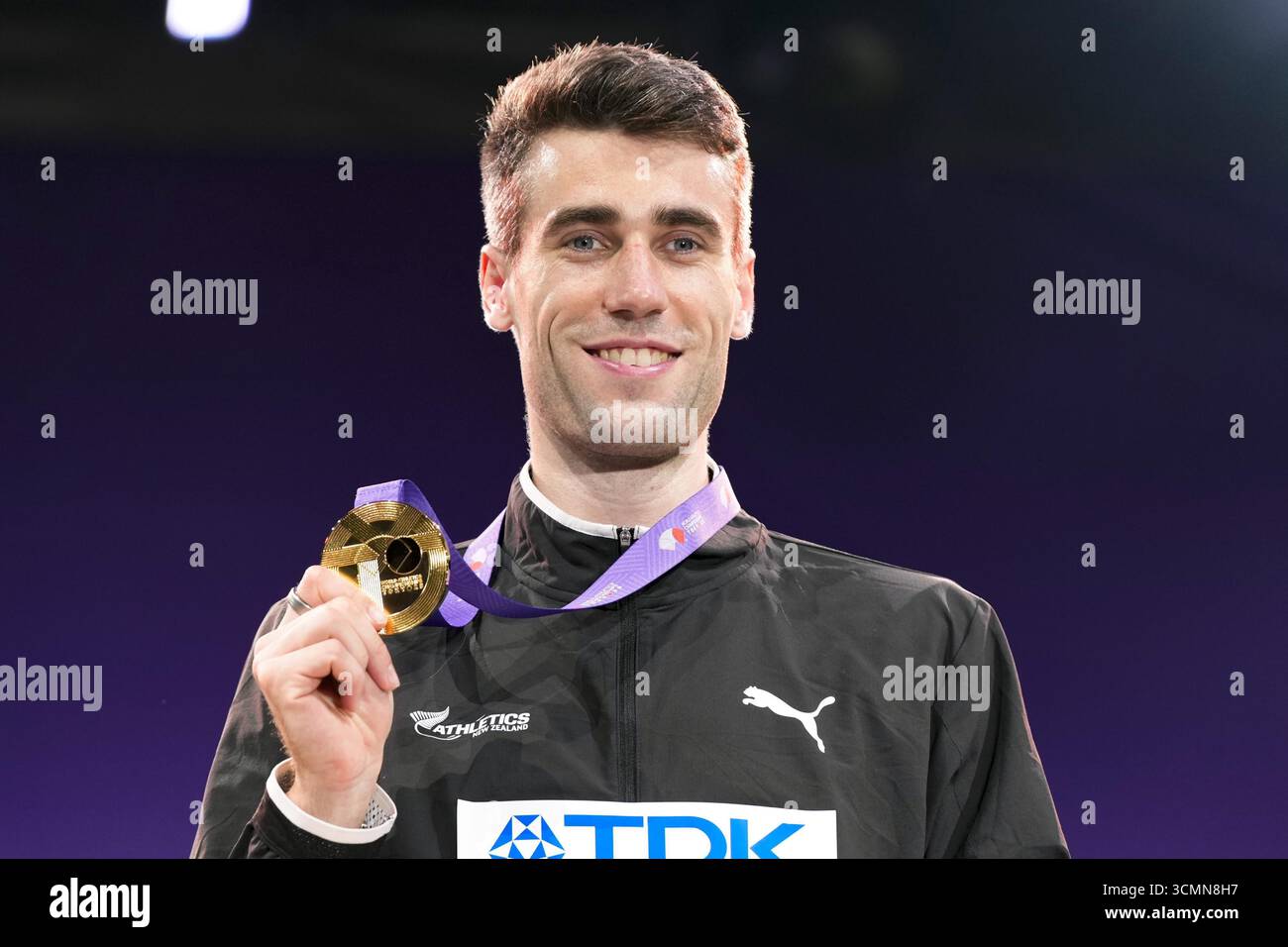 Gold medalist Hamish Kerr (C) of New Zealand poses during the medal ...