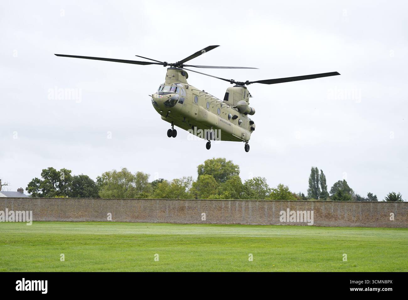 A Chinook lands ahead of the arrival of President Donald Trump and ...