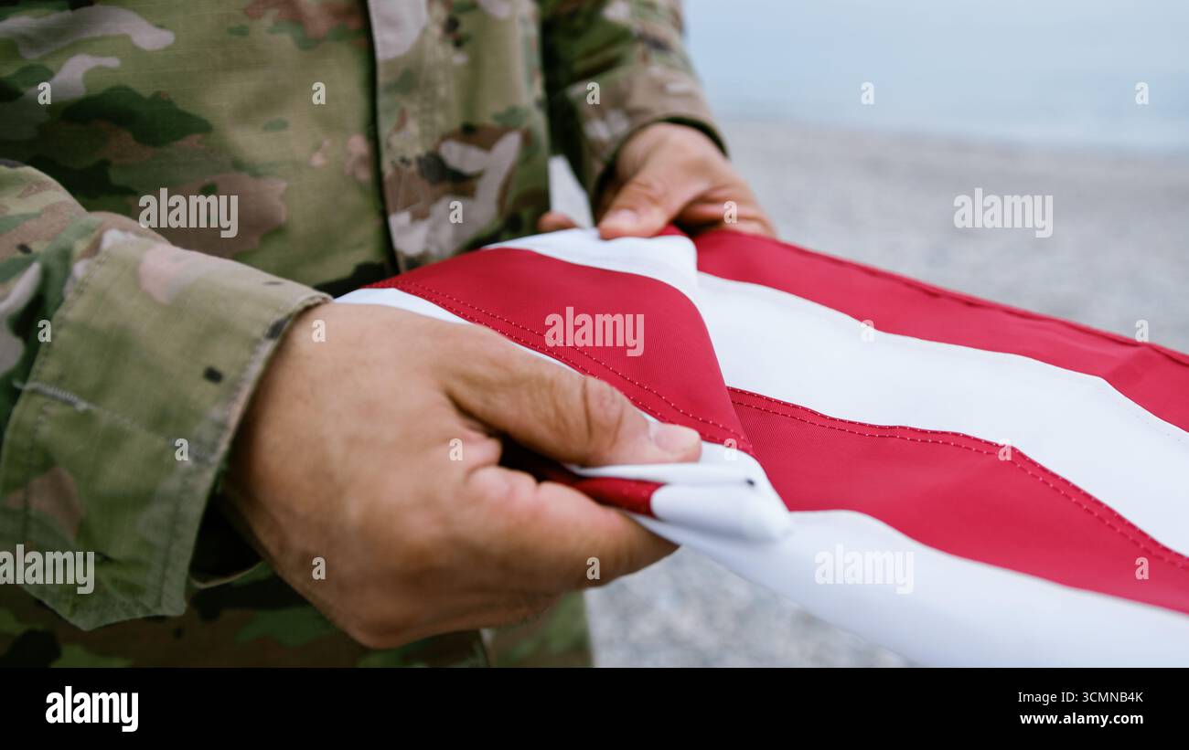 American Soldier Folding The USA Flag Stock Photo - Alamy