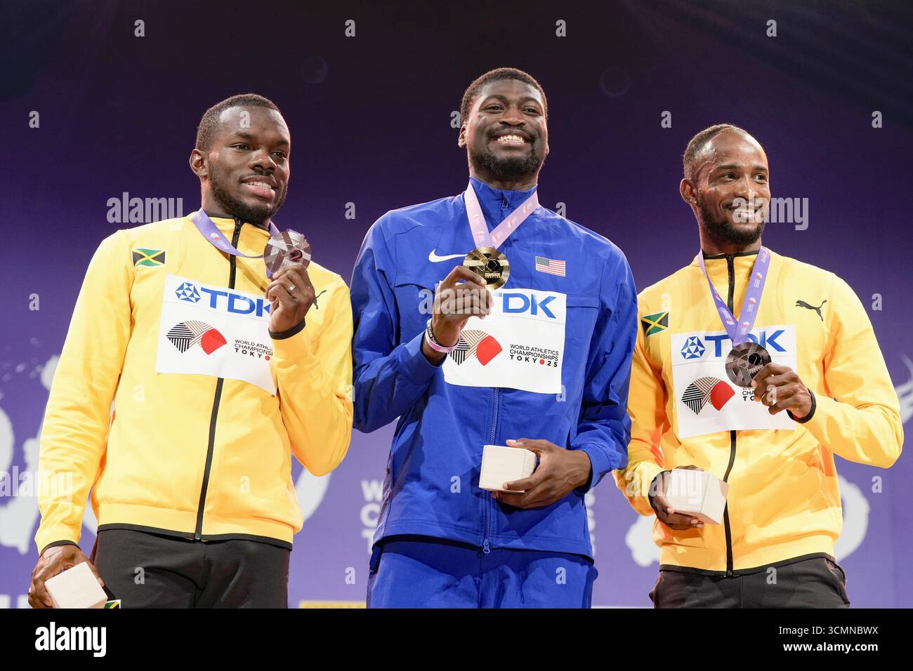 Gold medalist Cordell Tinch (C) of the United States poses for a photo ...