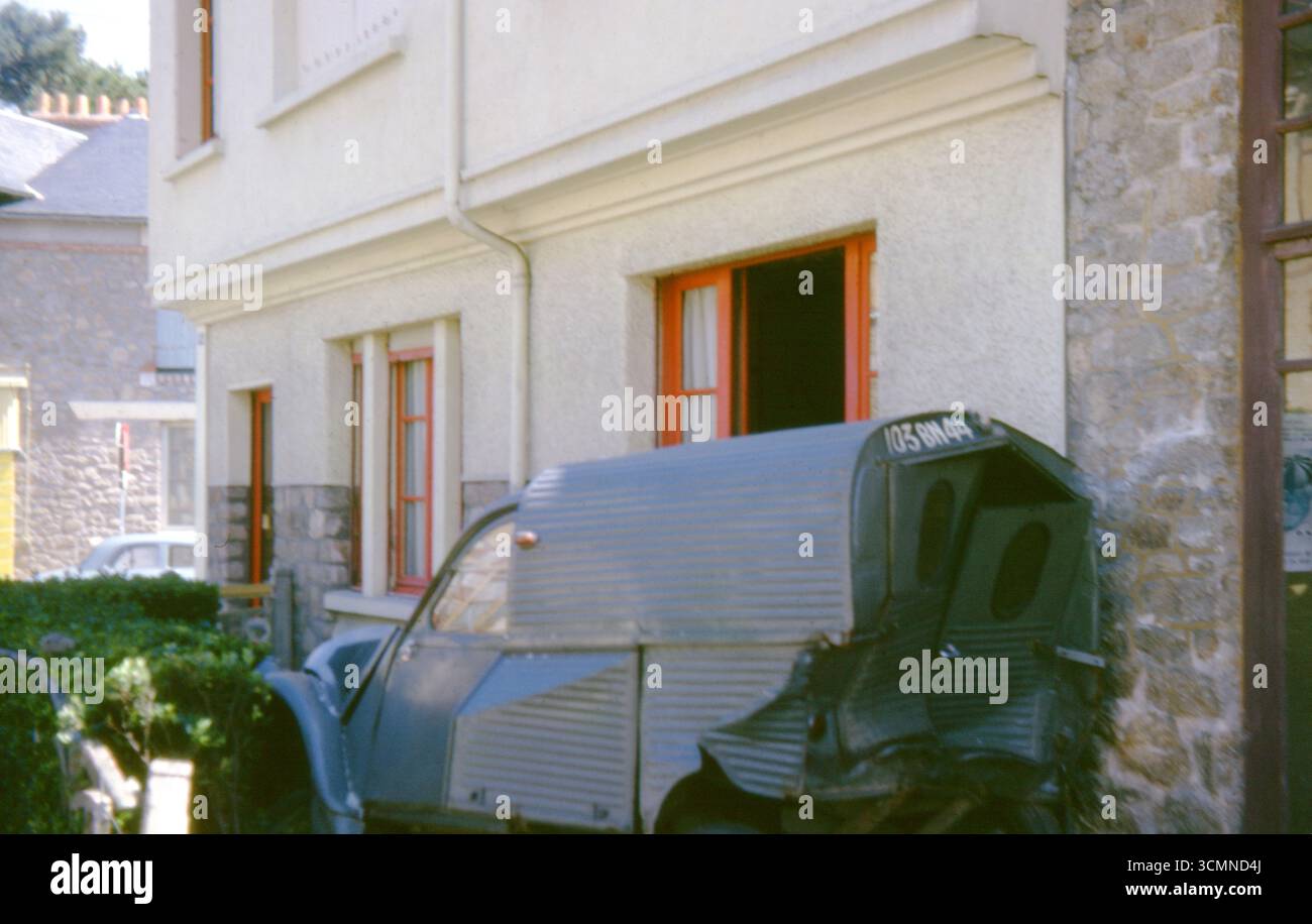 Damaged Citroën 2CV Fourgonnette van parked outside a stone house ...