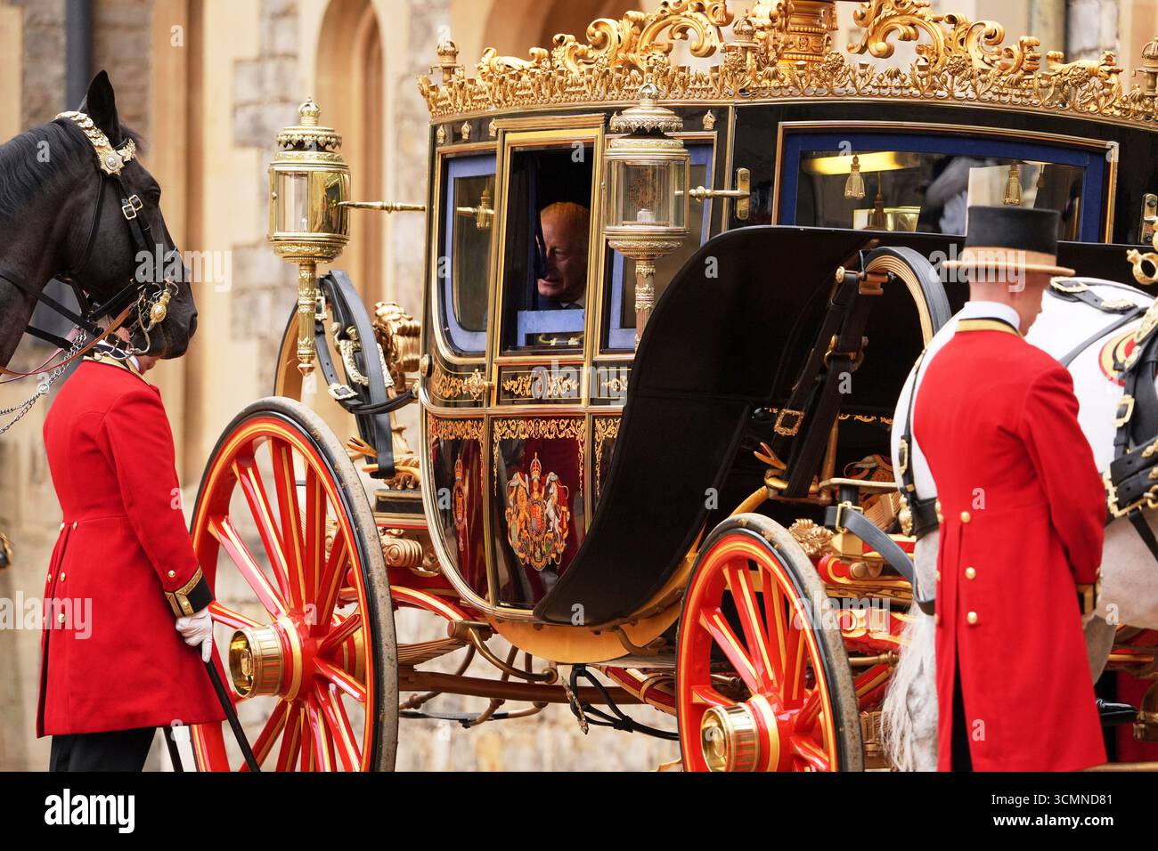 Britain's King Charles III looks out the window of the Irish State ...