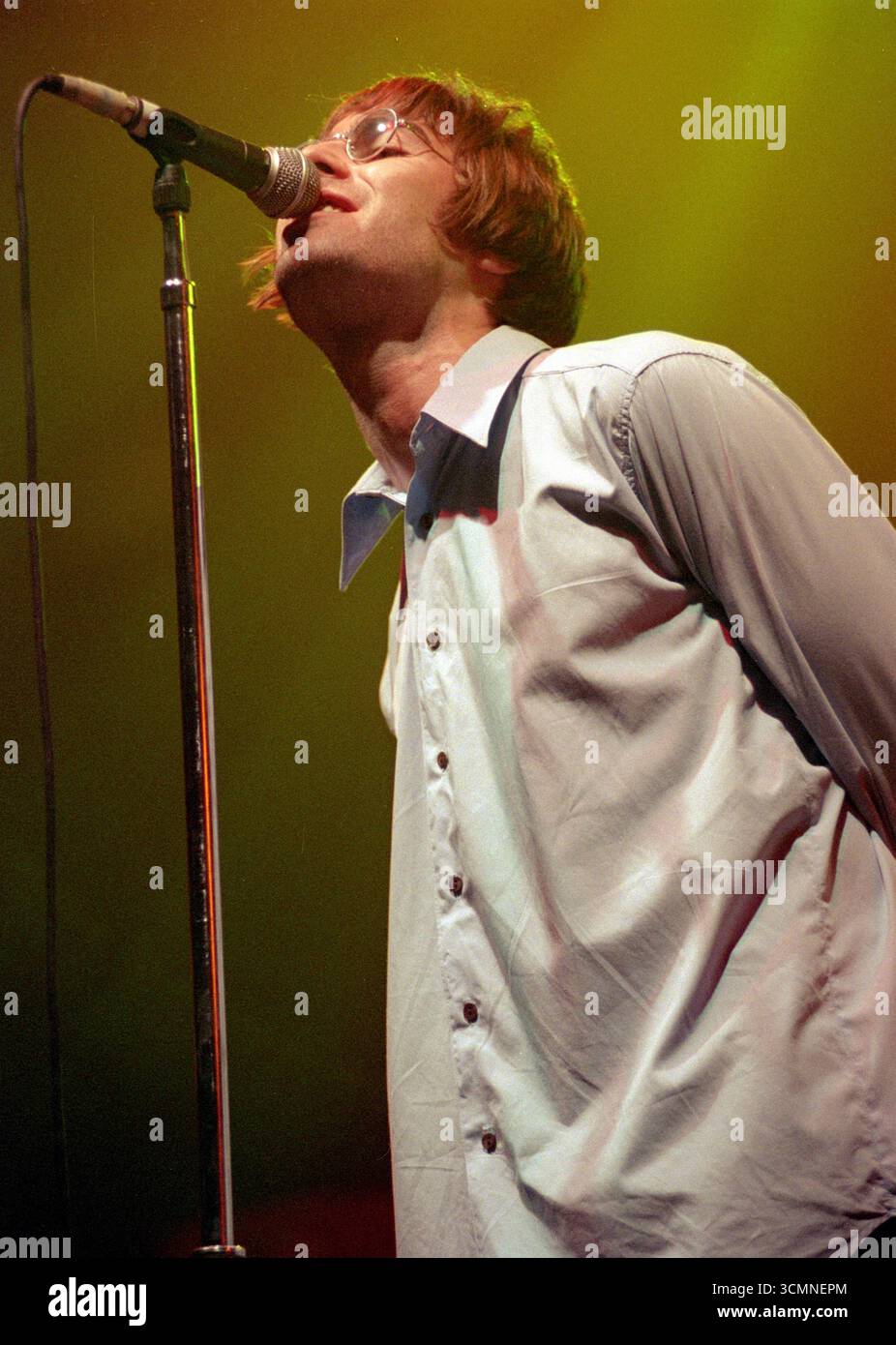 Singer Liam Gallagher on stage at the microphone during the Oasis ...