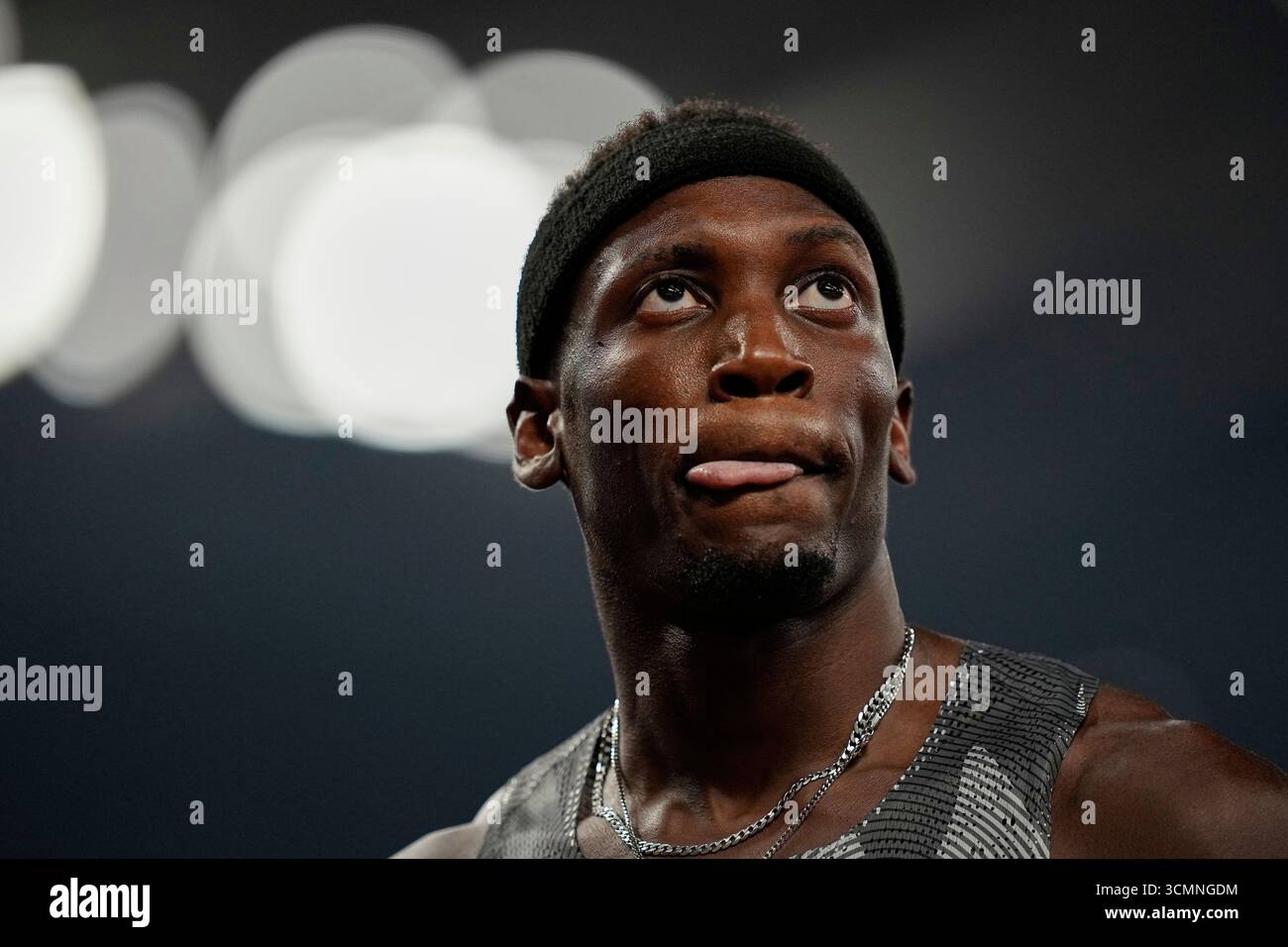 Zimbabwe's Tapiwanashe Makarawu looks up after finishing a men's 200 ...