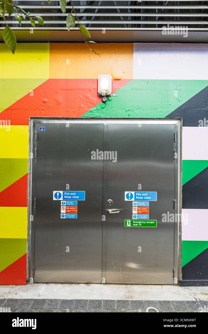 Stainless Fire Exit Door with Safety Signage Stock Photo - Alamy