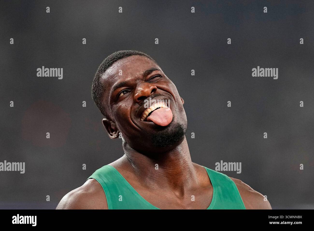 Nigeria's Ezekiel Nathaniel reacts after finishing a men's 400 meters ...